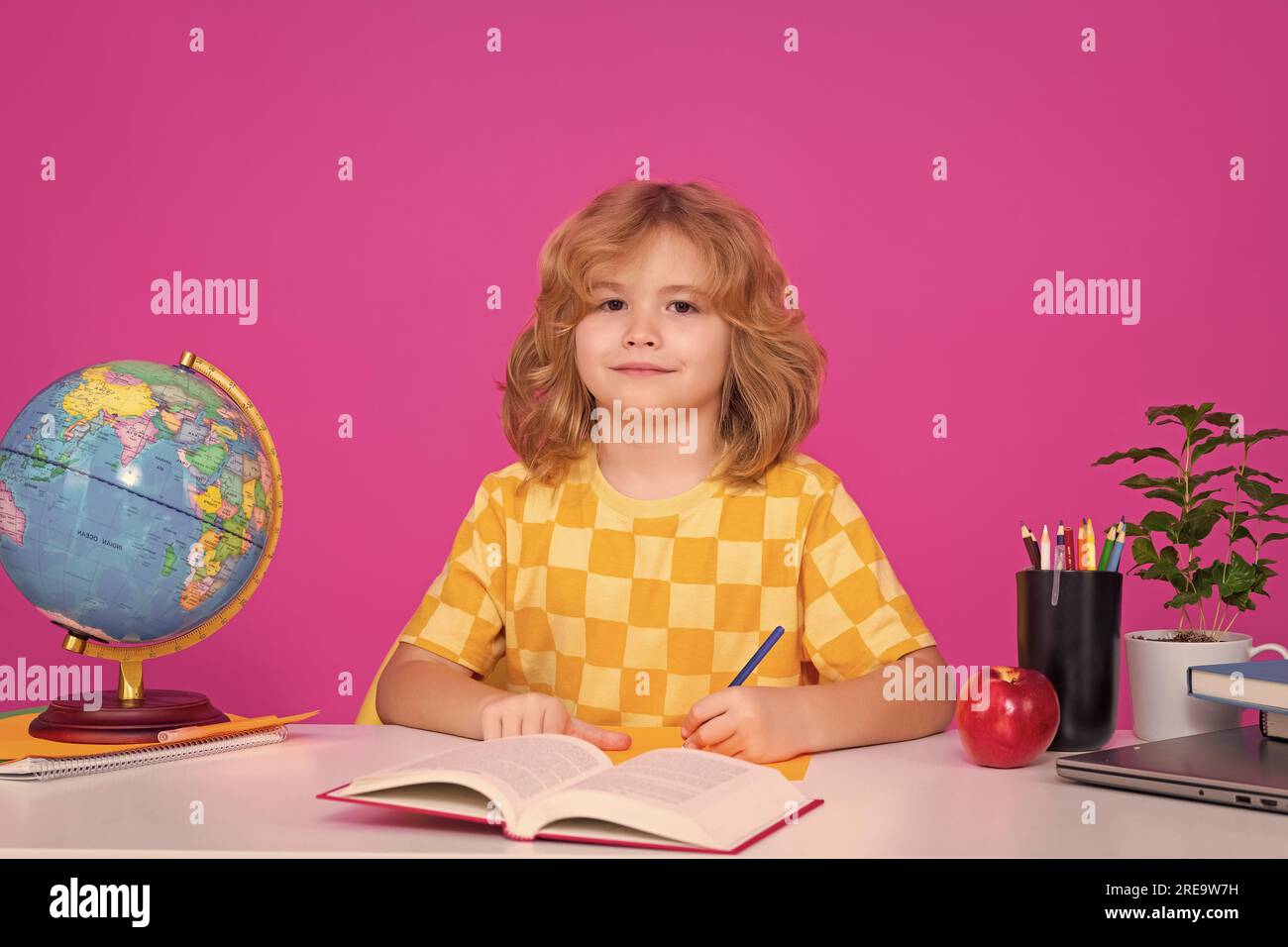 Kid boy from elementary school with book. Smart caucasian school boy ...