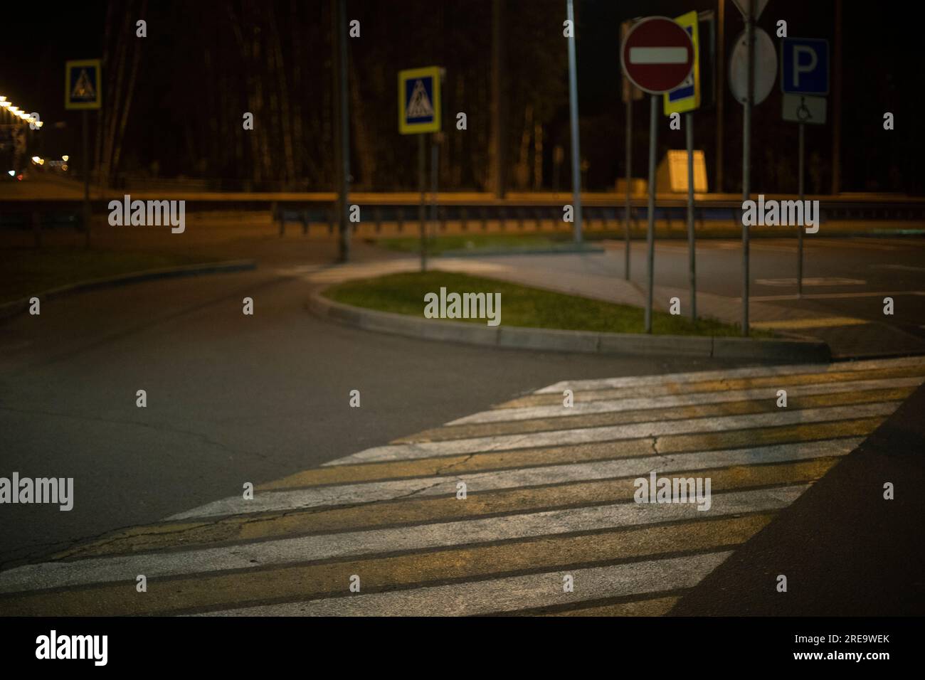 Pedestrian crossing in evening. Transport markings on asphalt. Lanes ...