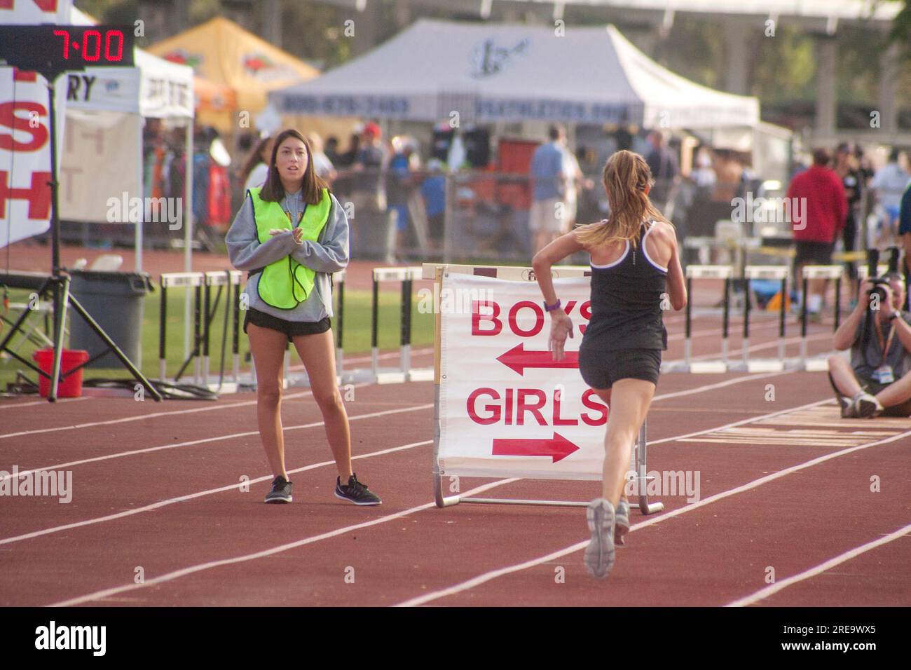 September 8, 2017: A high school girl crosses the finish line at a ...