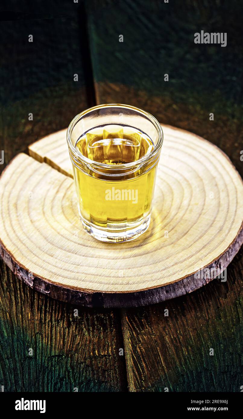 Brazilian cachaça glass, with Brazilian flag texture in the background ...