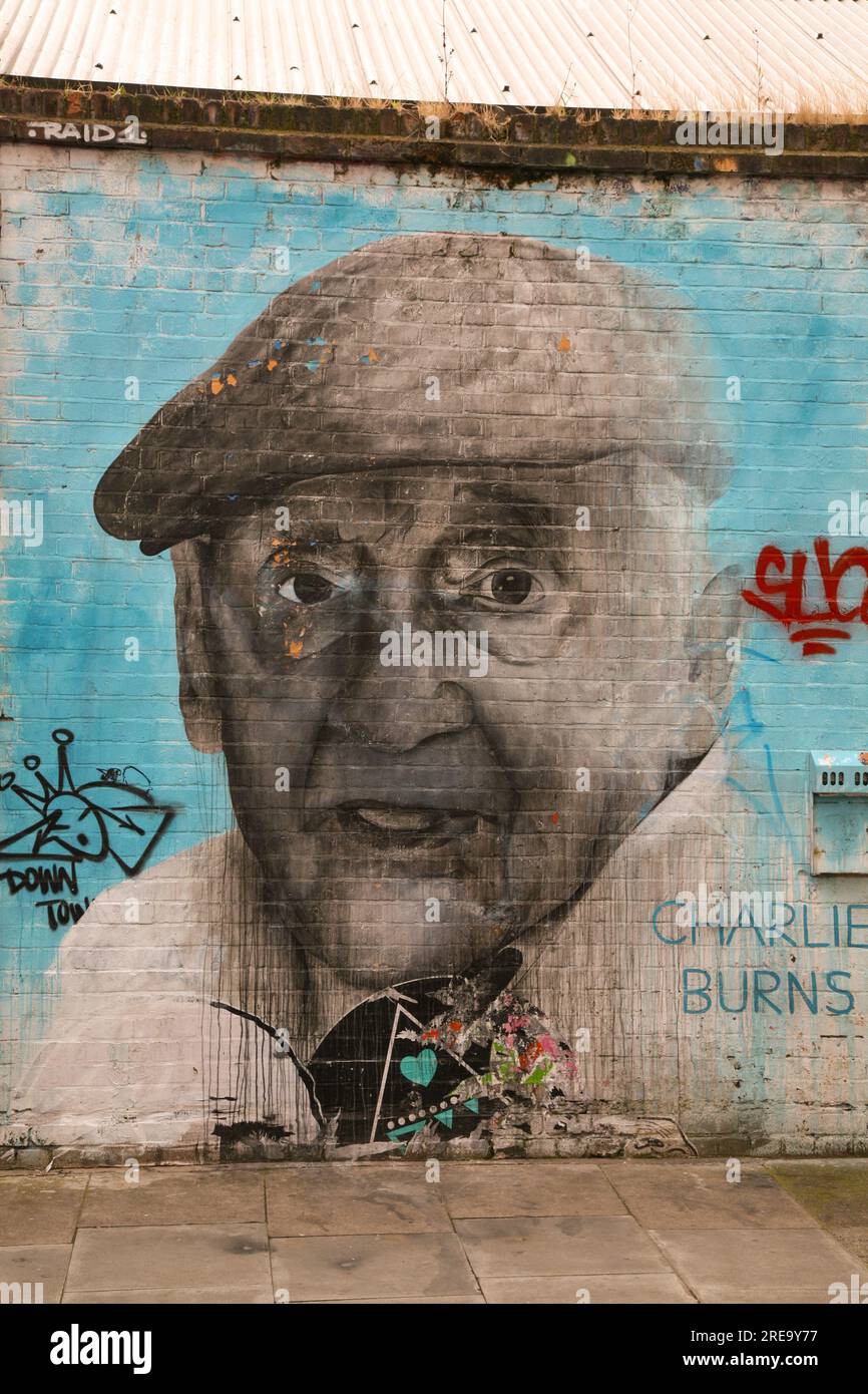 Portrait of famous east London resident Charlie Burns on a brick wall ...
