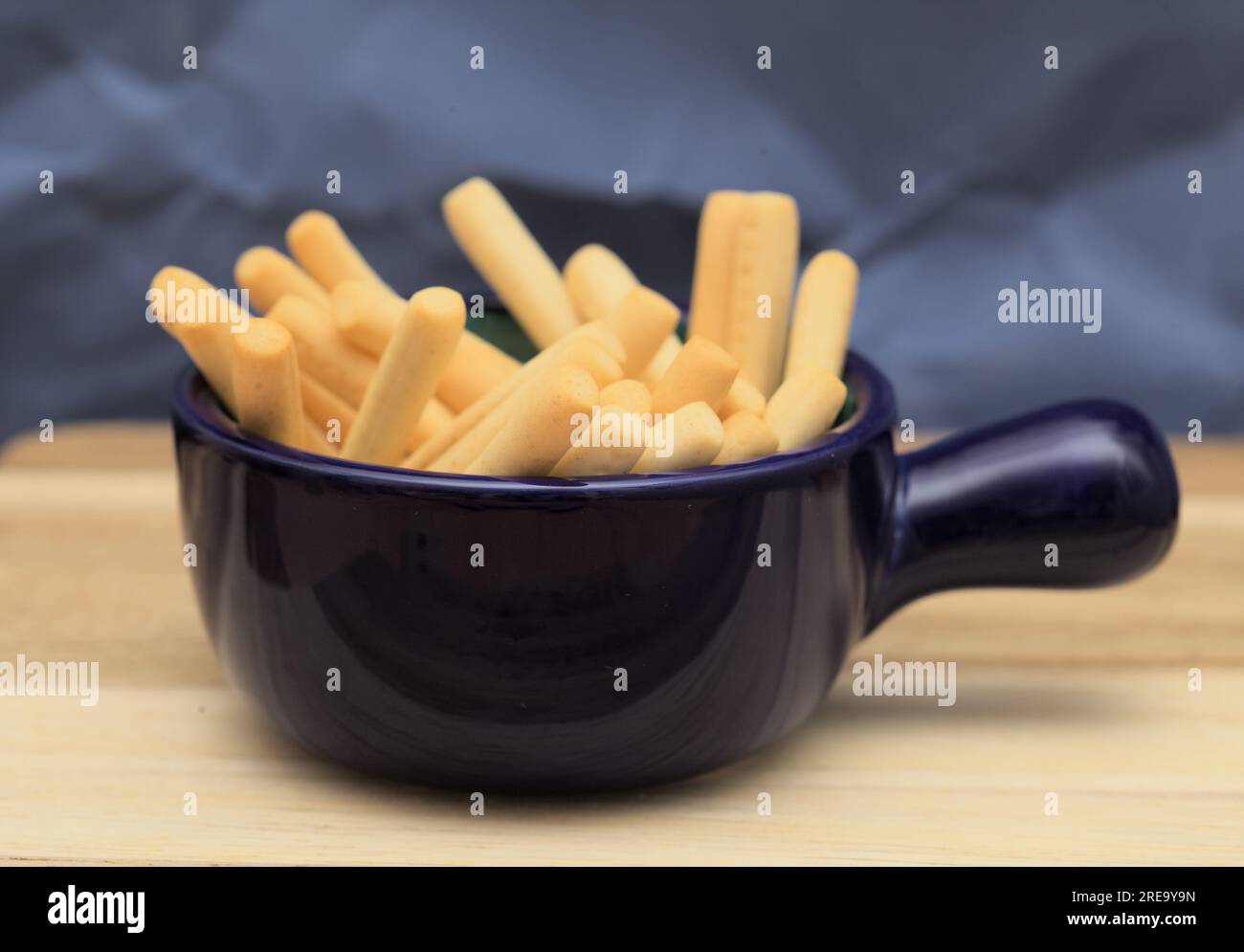 Handfull of short thin white bread breadsticks aka grissini Stock Photo ...