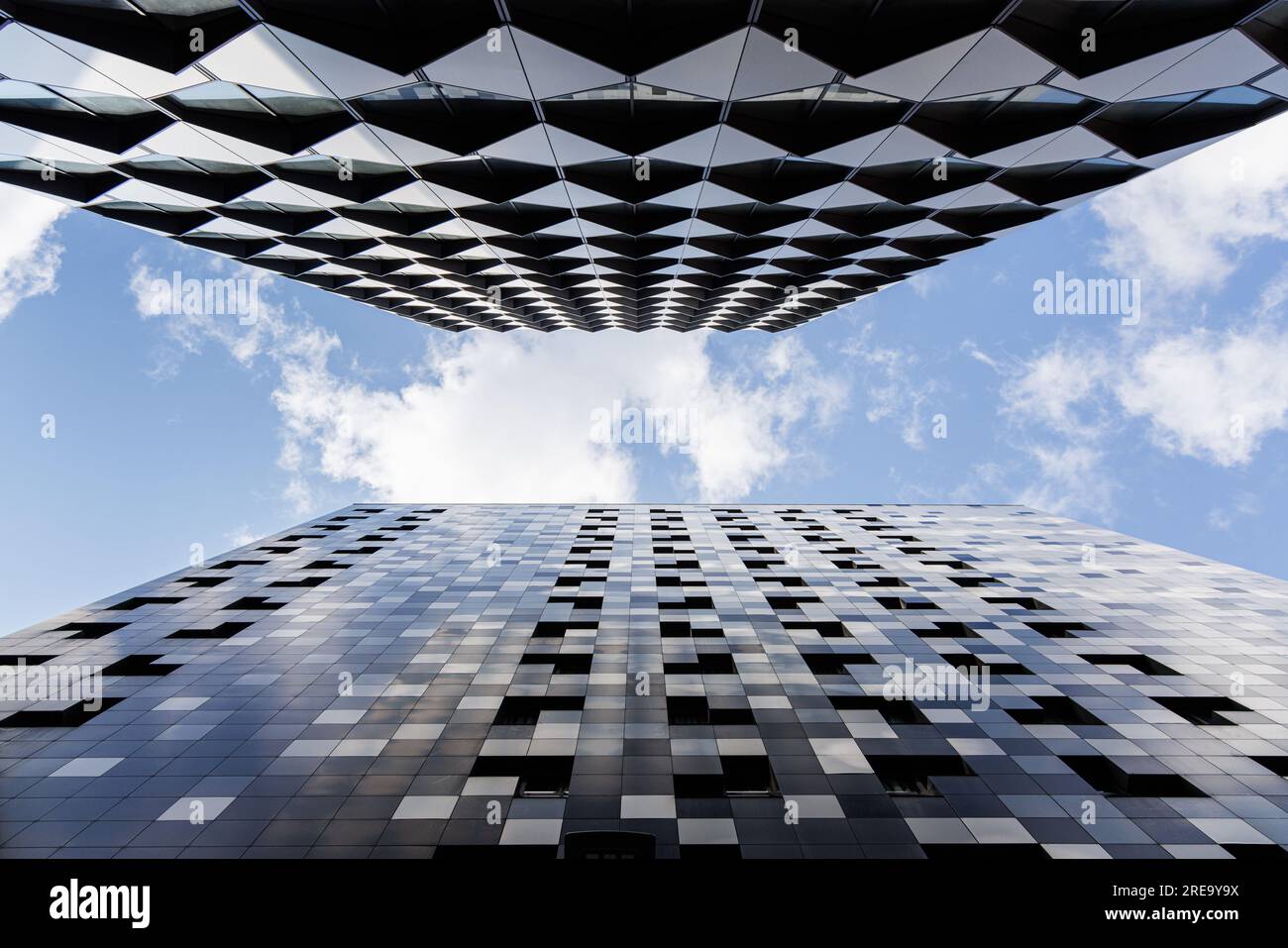 Birmingham, West Midlands, UK - July 2023: A view upwards between the ...