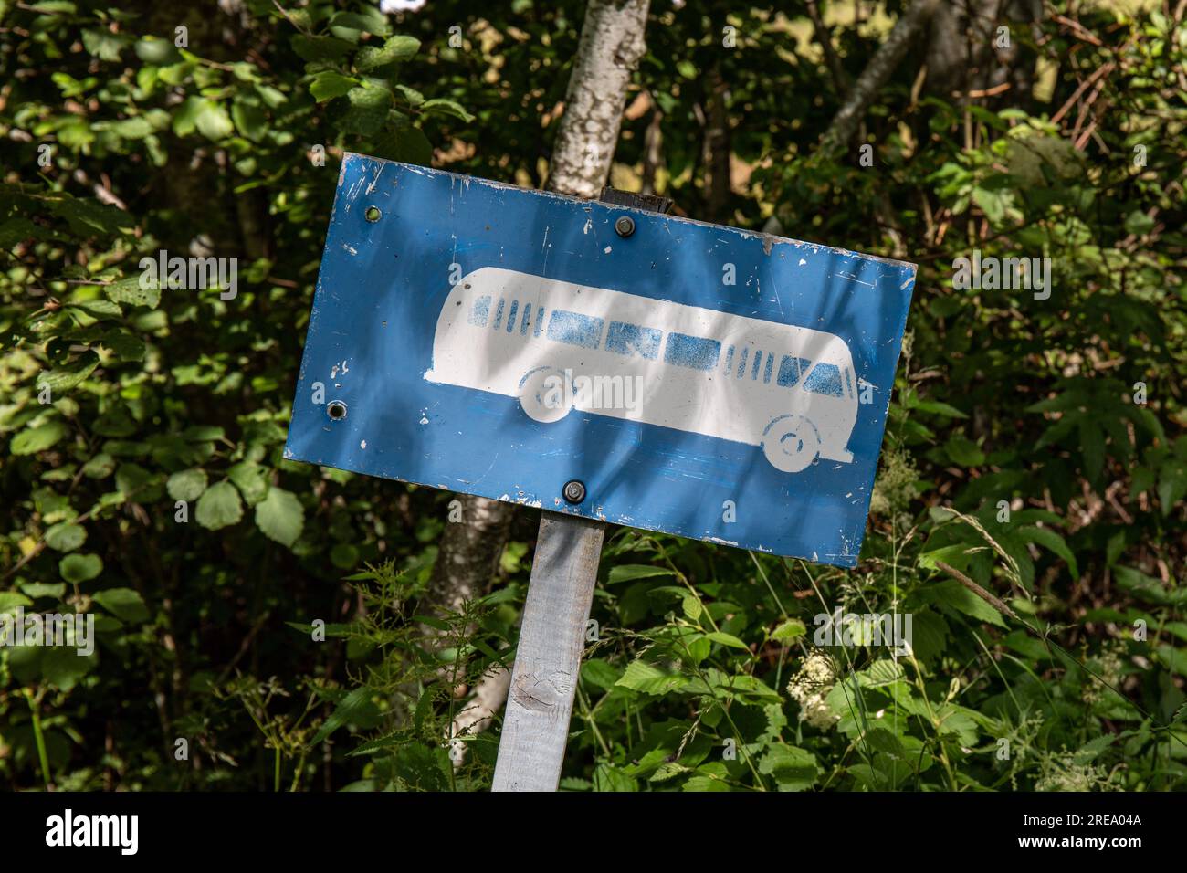 Weathered and tilted old bus parking sign at Art Center Purnu parking ...