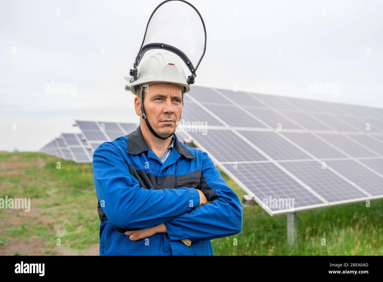Service Engineer man standing with arms crossed in front of solar ...