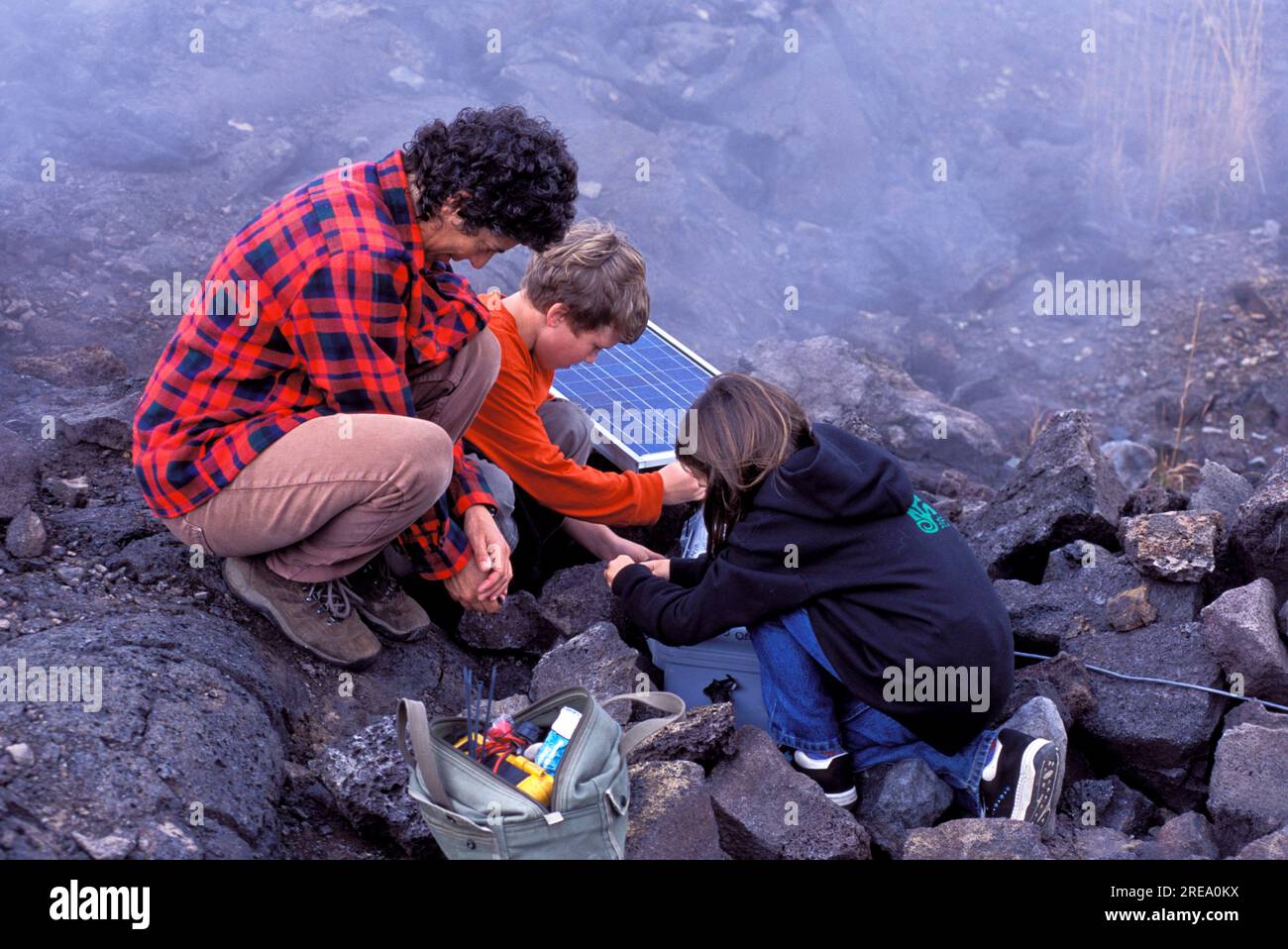 Women scientist and kids at Hawaii Volcanoes National Park working with ...