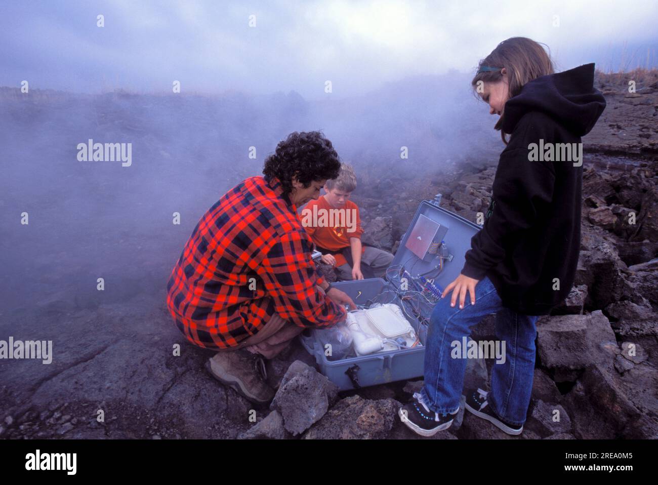 Women scientist and kids at Hawaii Volcanoes National Park working with ...