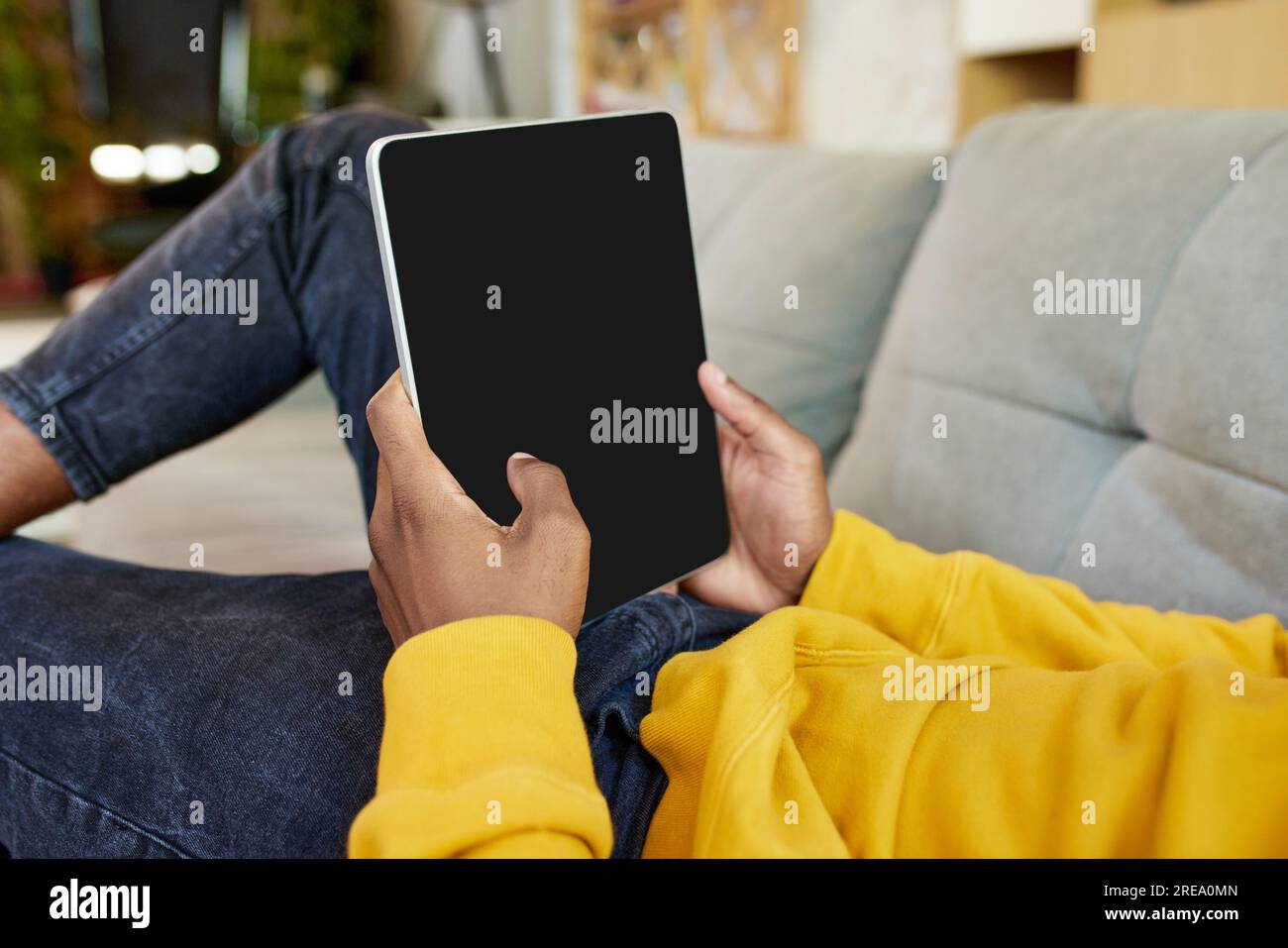 Close-up of male hands using tablet for work, study and entertainment ...