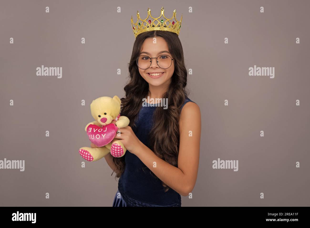 Birthday kids prom party. Little queen wearing golden crown. Teenage ...