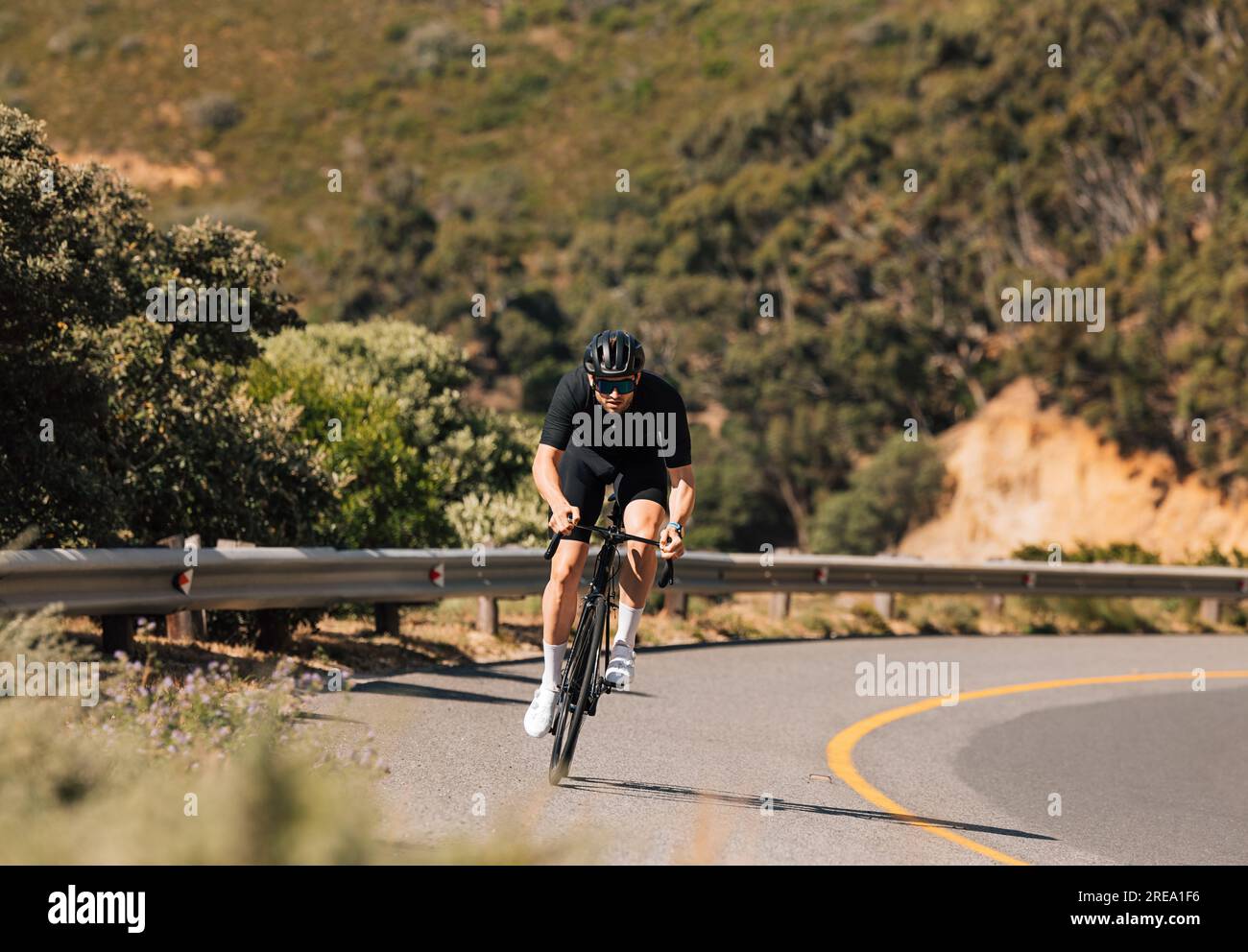 Cyclist on curvy mountain hi-res stock photography and images - Alamy