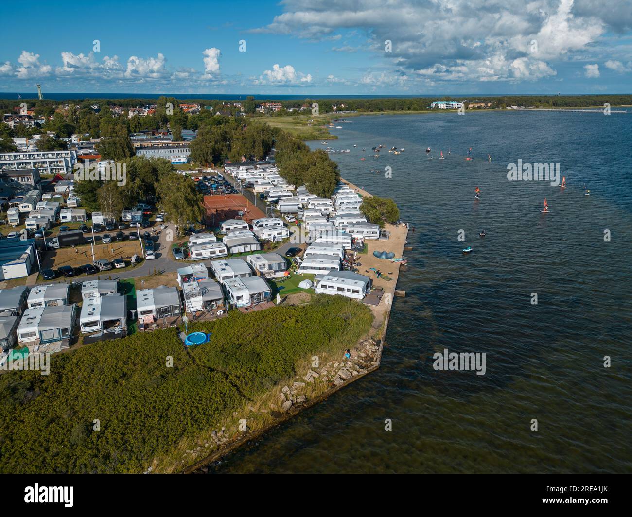 camping with trailers and campers at sea shore with beach, campsite ...