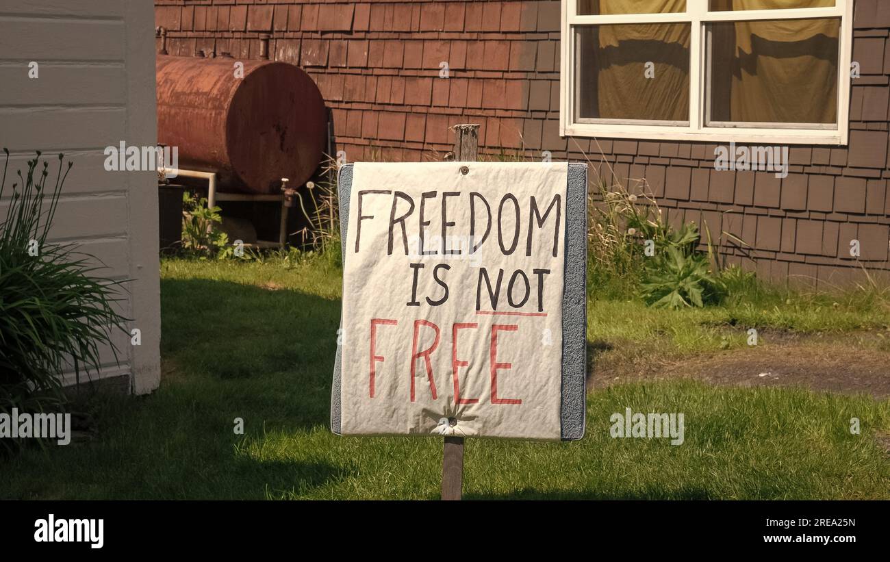 Placard with Freedom is not free inscription. Handwritten placard ...