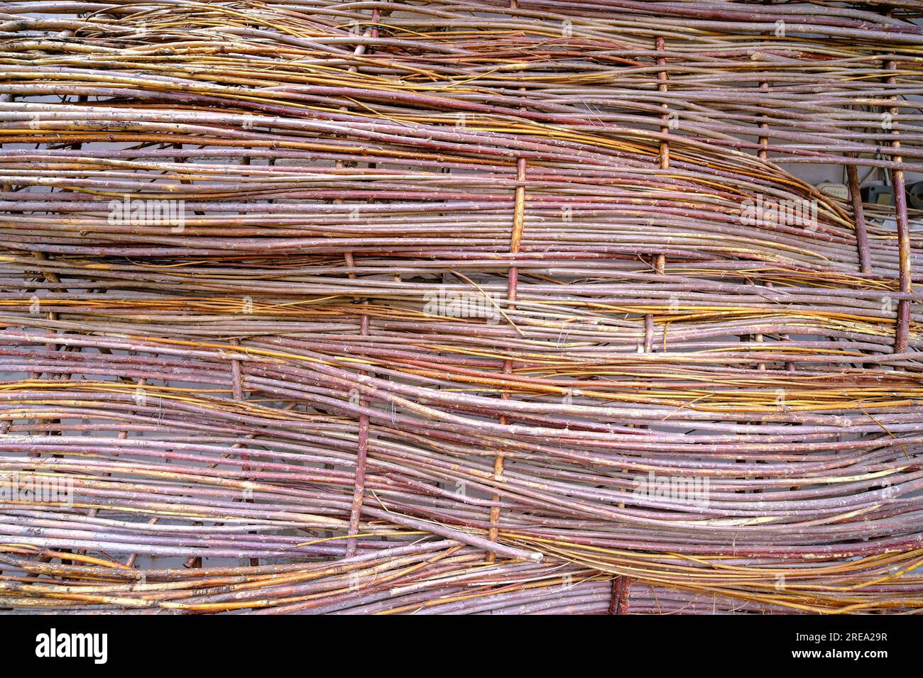 The wall is woven from branches. beautiful wall decor, background Stock ...