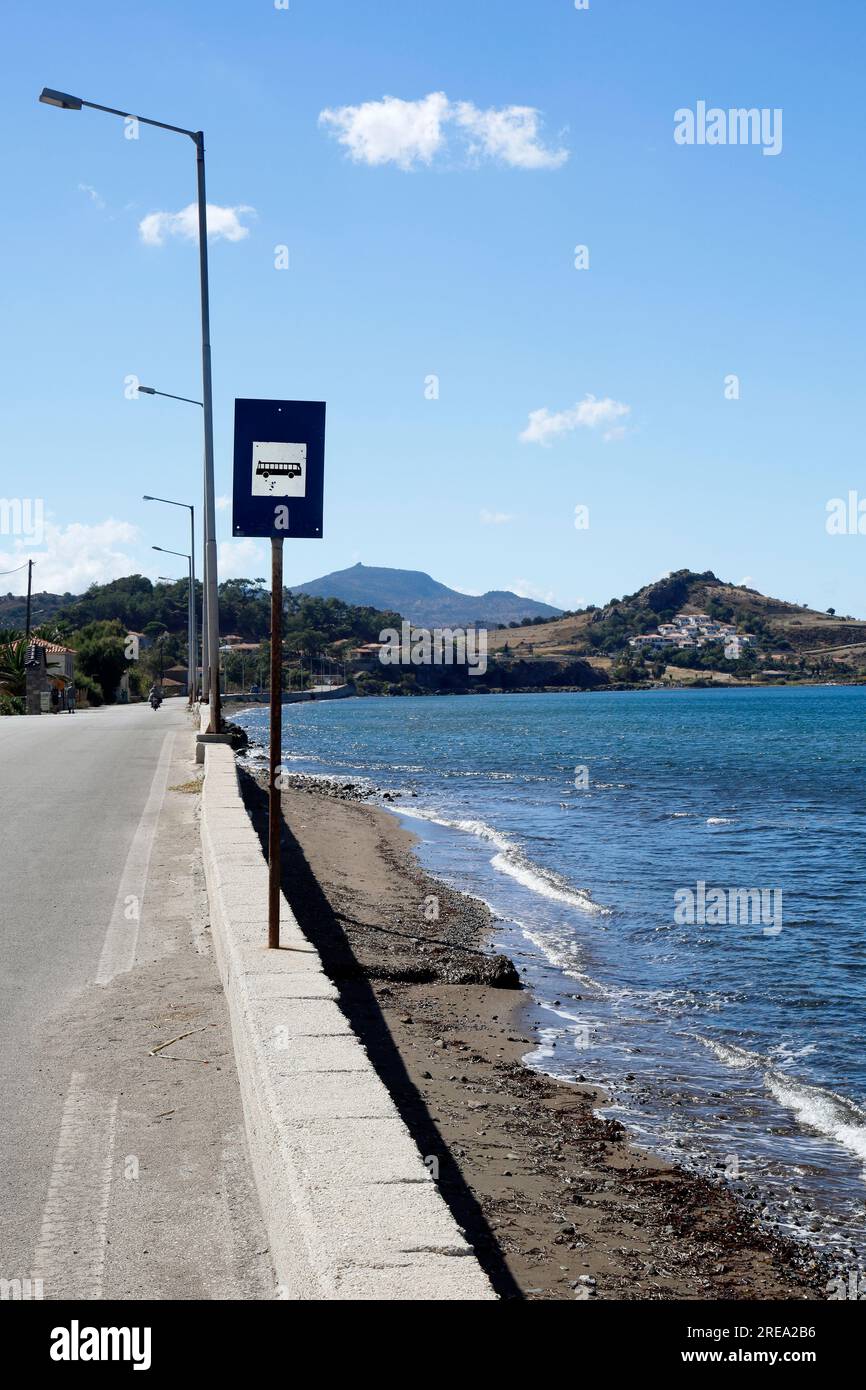 Greek sign for a bus stop alongside coast road from Petra village Stock ...