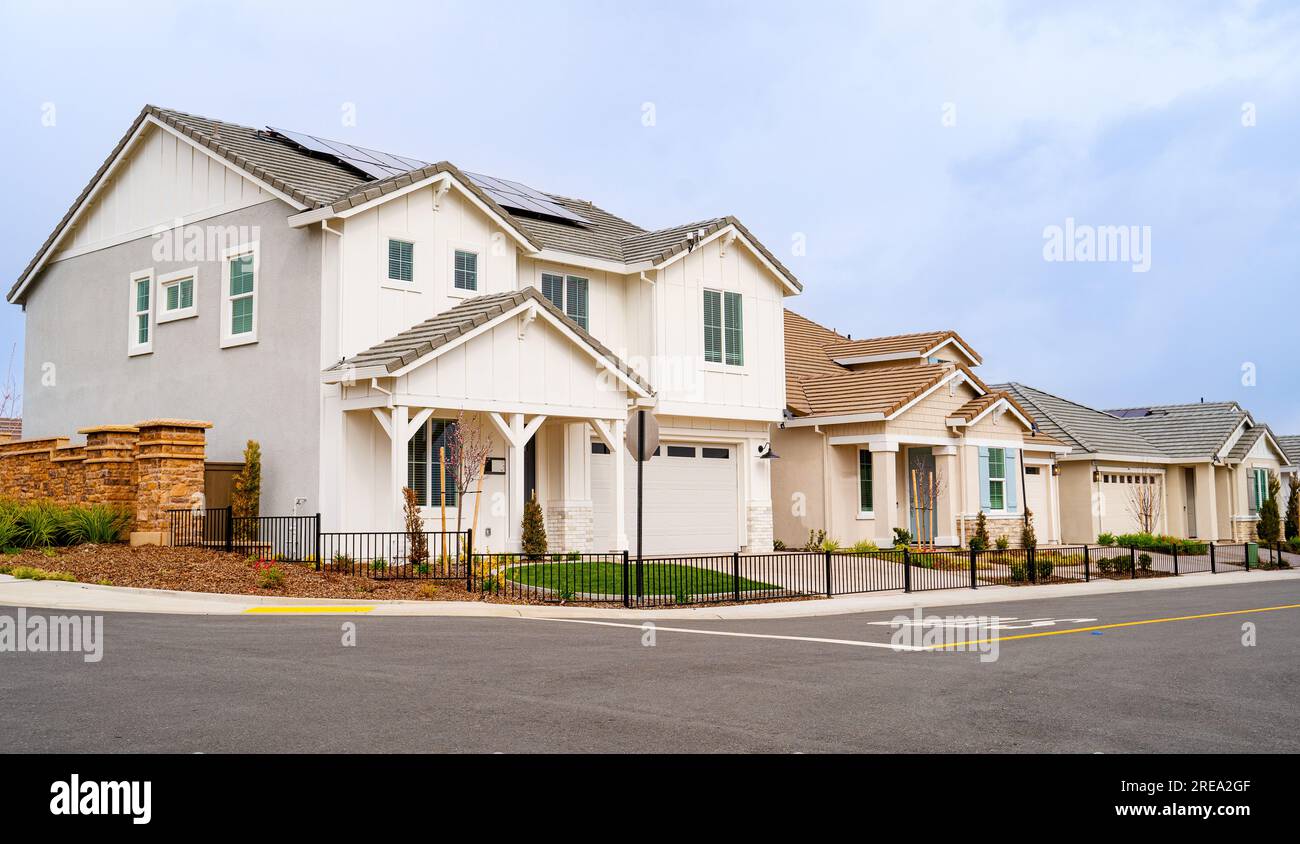 Model homes in a row Stock Photo - Alamy