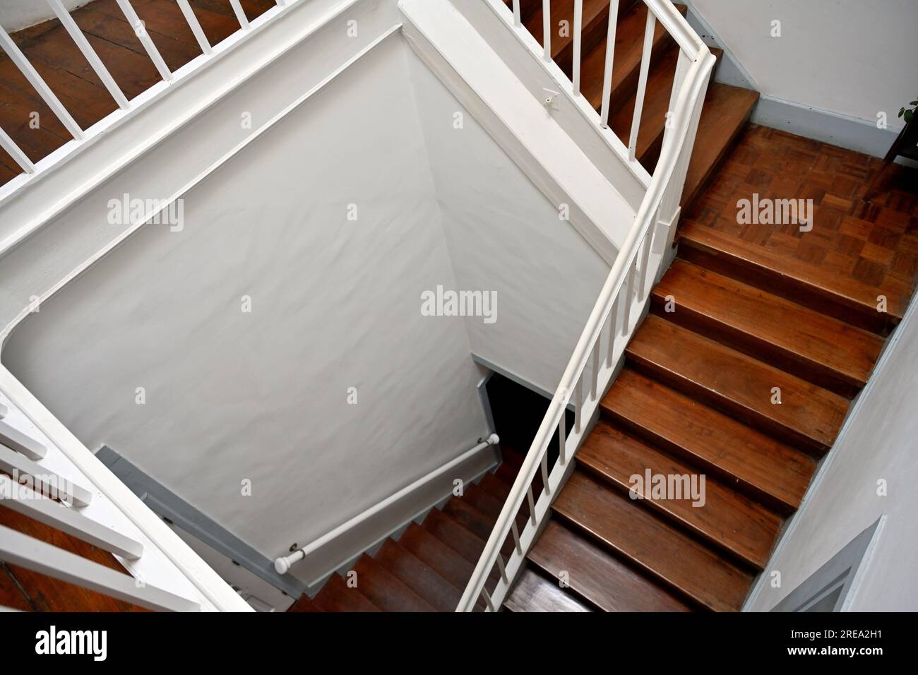 Traditional wooden interior stairs with landing Stock Photo - Alamy