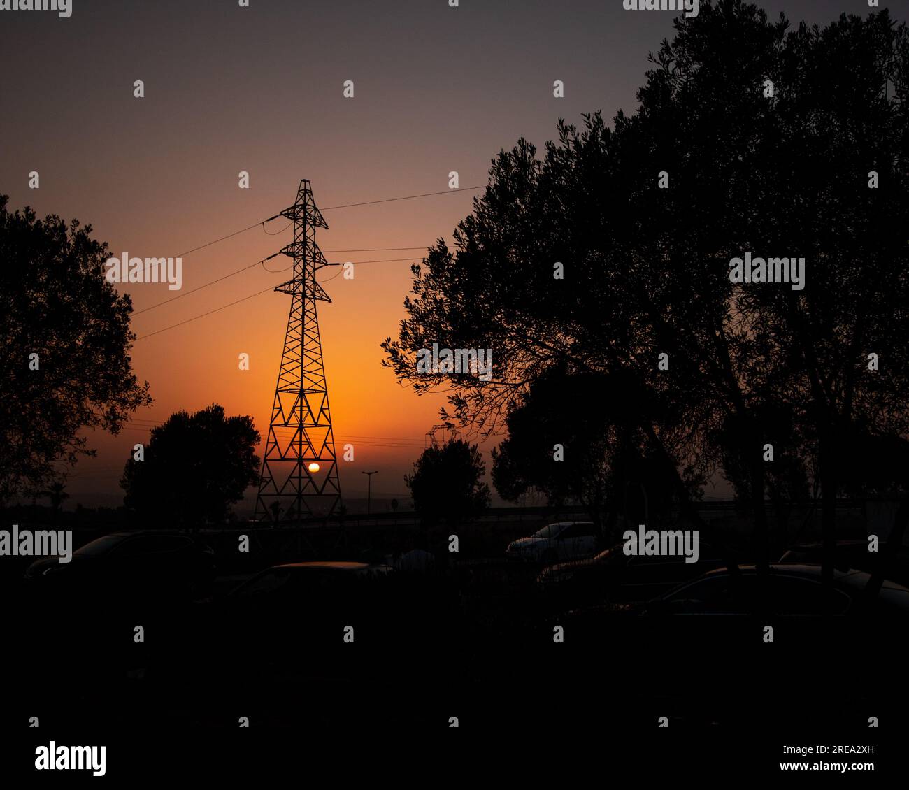 The shadow of an electric pole, during an orange sunset, the shadows of ...