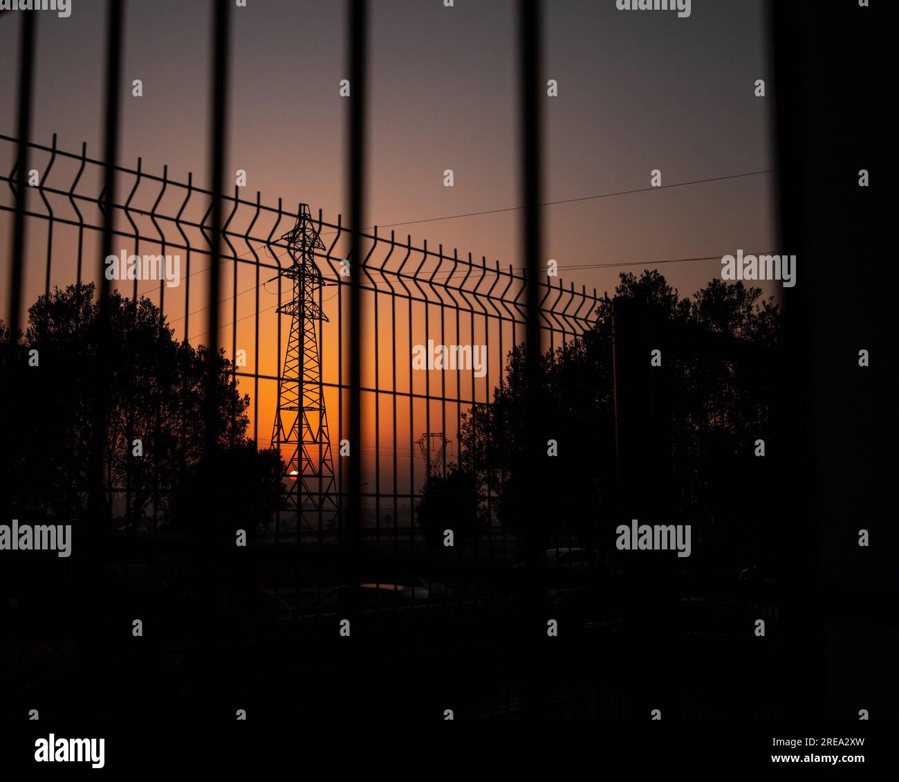 The shadow of an electric pole, during an orange sunset, the shadows of ...