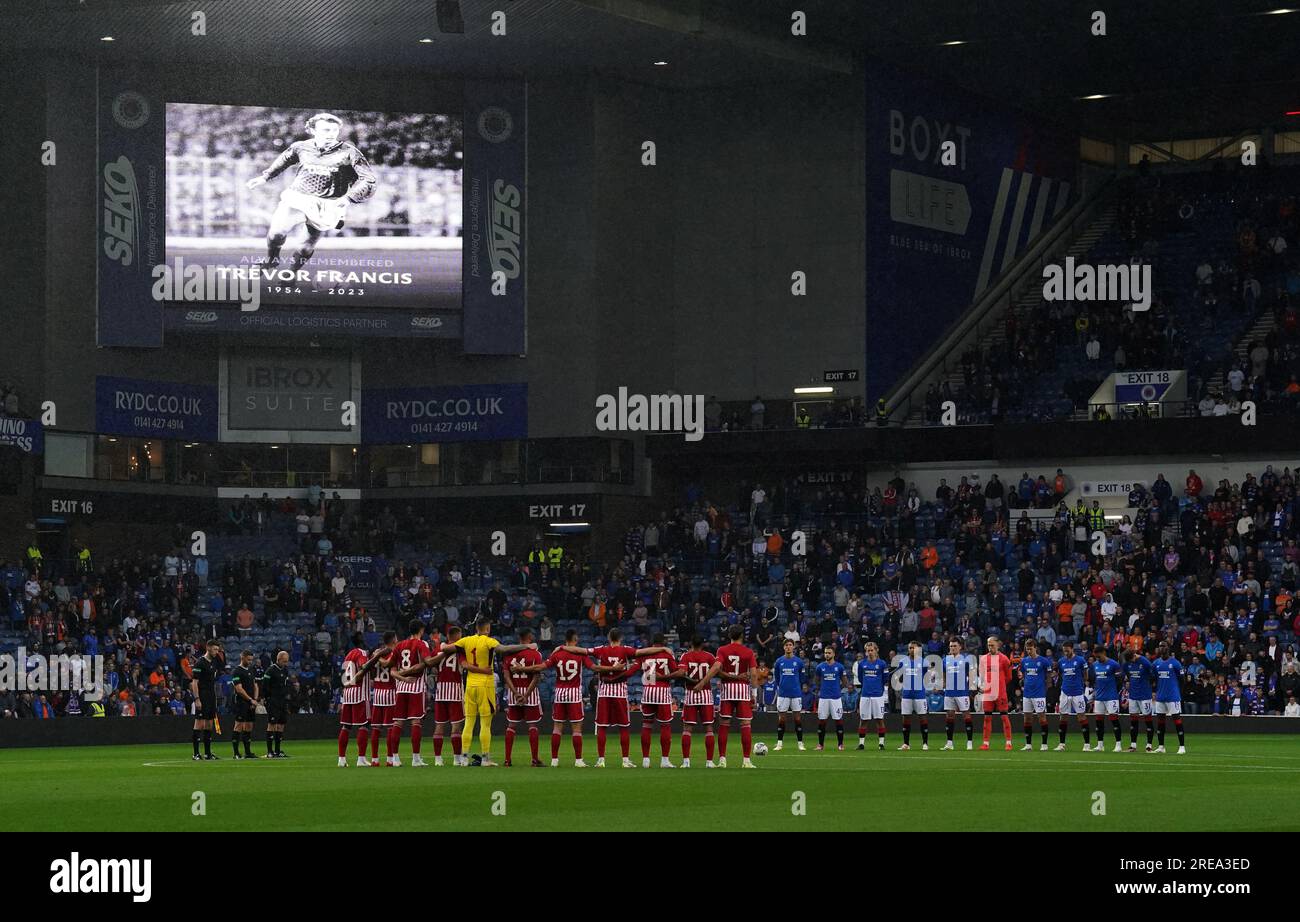 The players stand for a minute's silence in memory of Trevor Francis ...