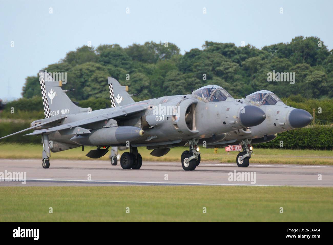 Pair of BAe Sea Harrier FA2 fighter jet planes lining up to take off to ...