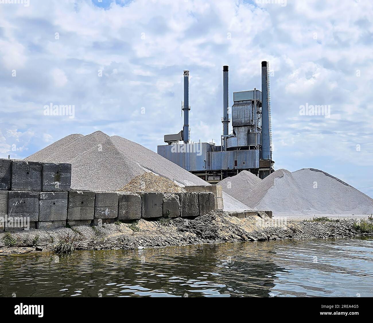 Dismantled old power plant with limestone piles in Michigan Stock Photo ...