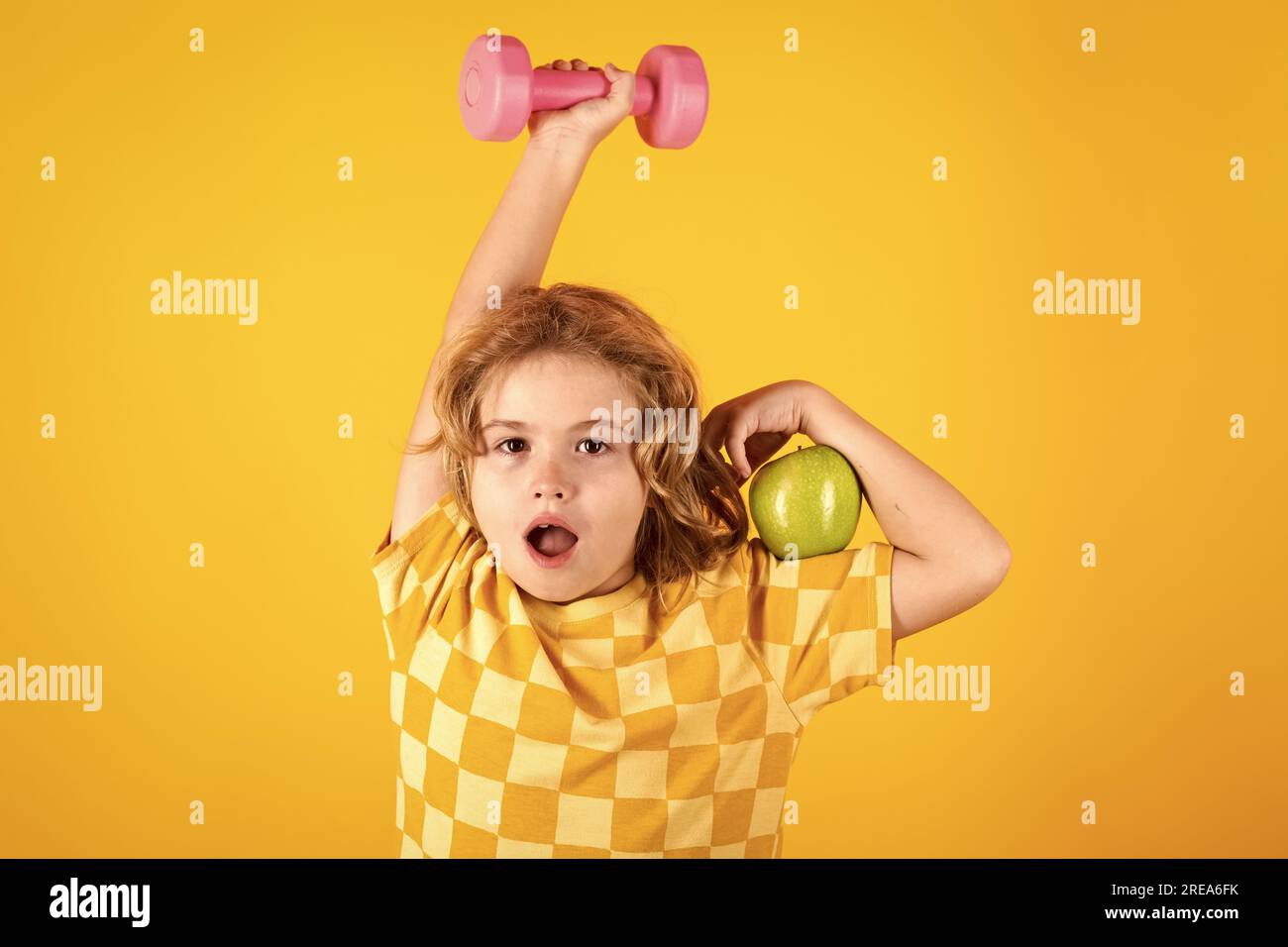 Child boy working out with dumbbells. Kids sport and active healthy ...
