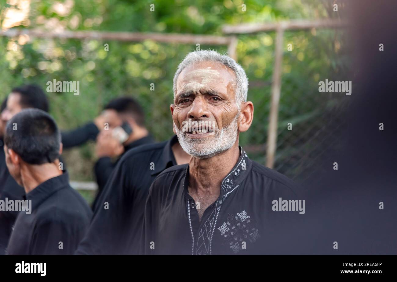 Srinagar, India. 26th July, 2023. A Shia Muslim man smeared mud on his ...
