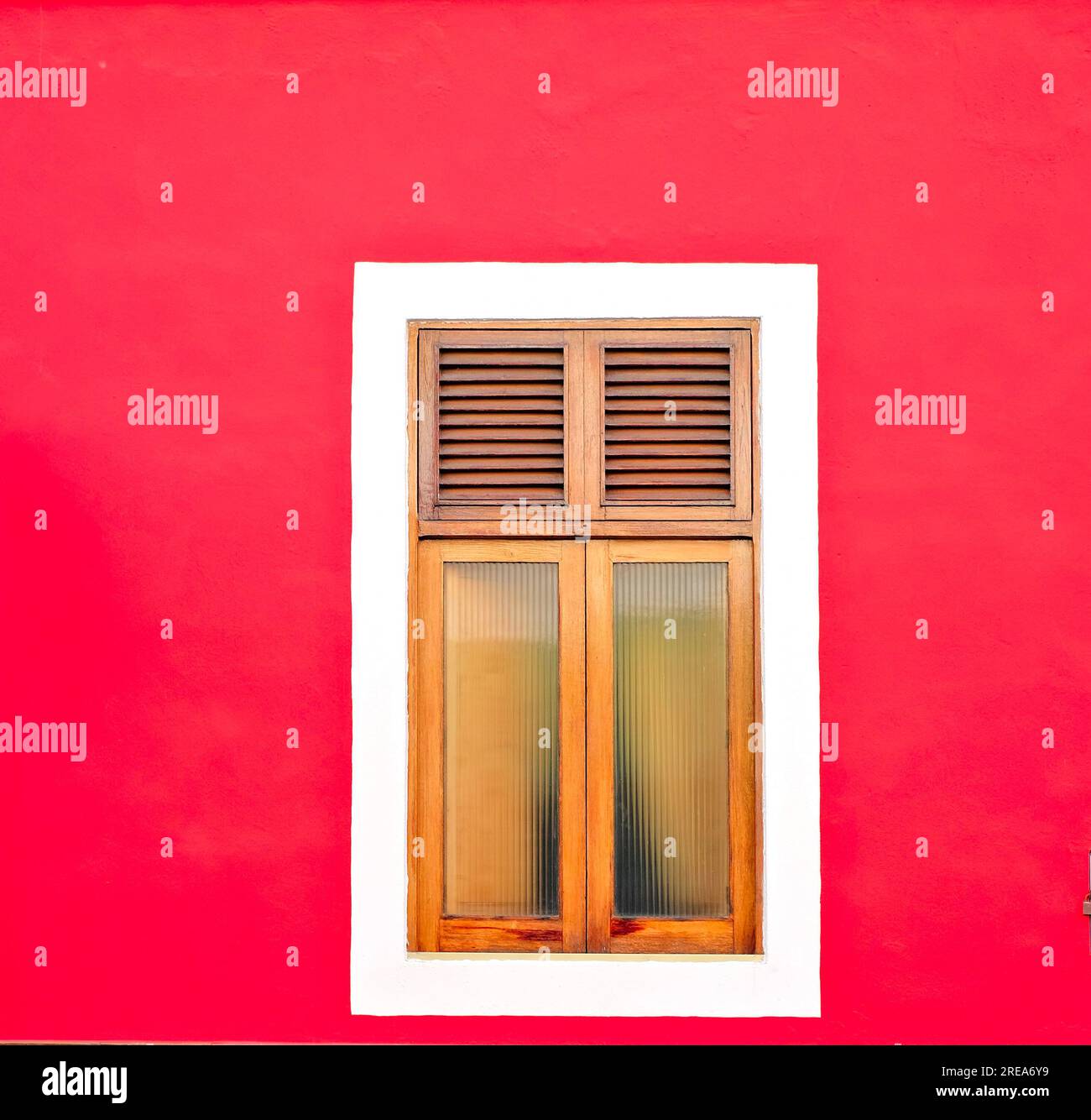 One simple wooden window in a red wall Stock Photo - Alamy