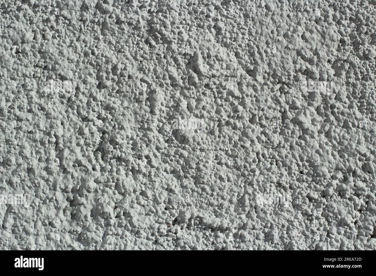 White wall. Rough surface. Irregularities on wall. Details of building ...