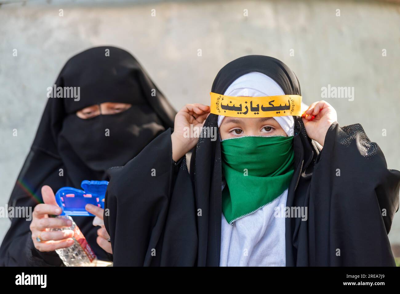 Srinagar, India. 26th July, 2023. A Shia Muslim girl wears a religious ...