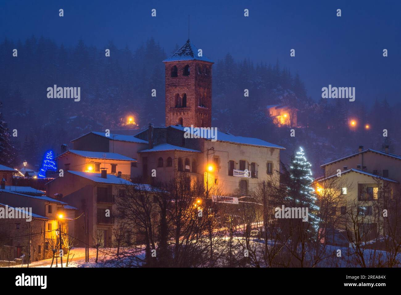 Espinelves village at dusk and at night during a winter snowfall (Osona ...