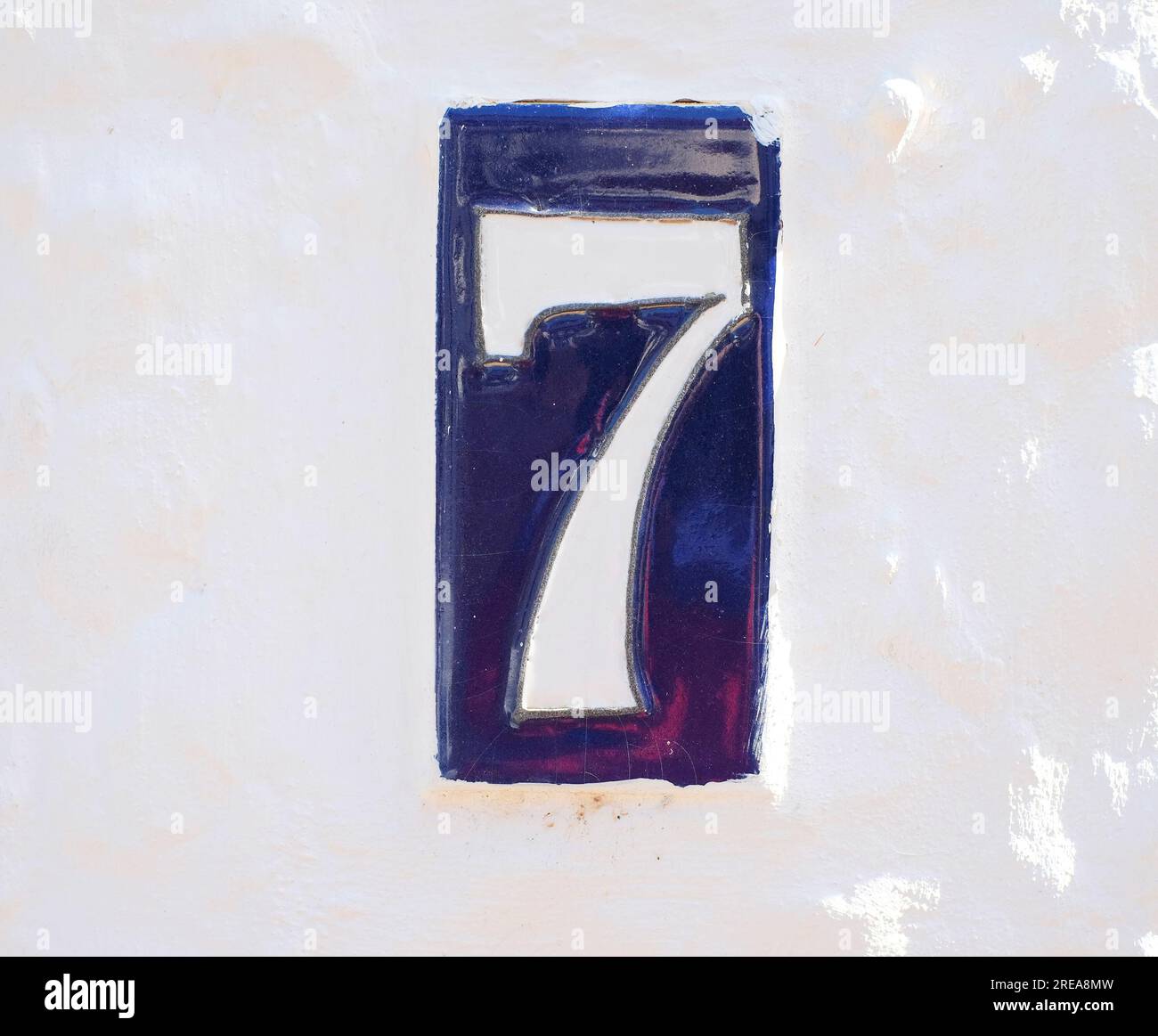Number 7, seven, blue tile on white background Stock Photo - Alamy