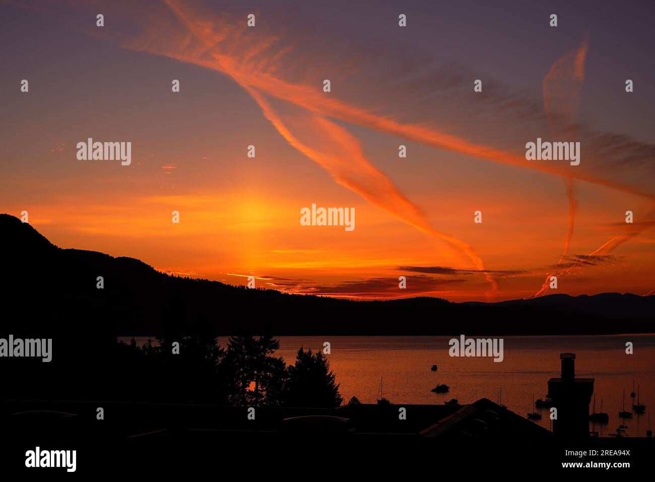 Sunset over an inlet Stock Photo - Alamy