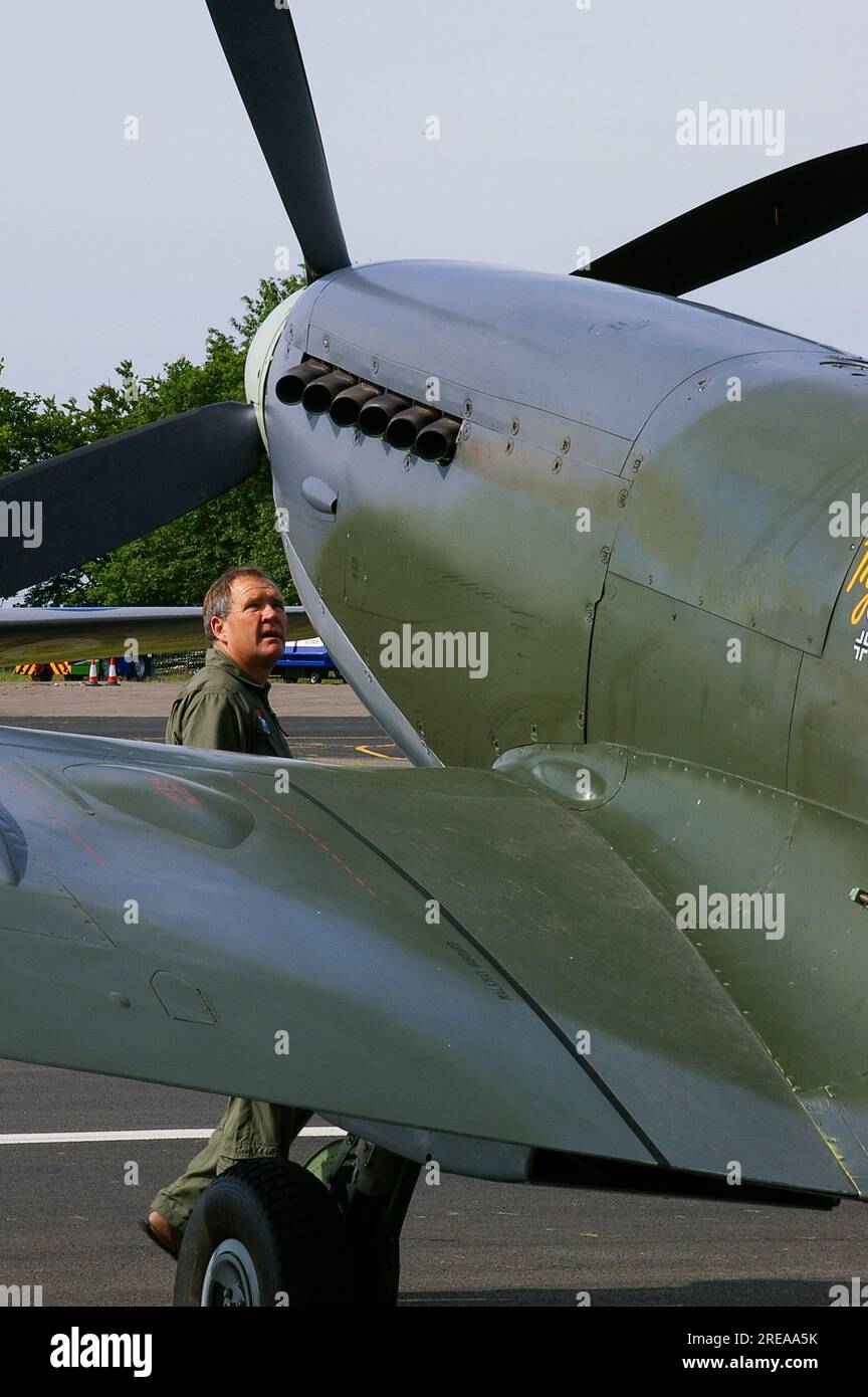Pilot Nigel Lamb preparing for flight in Second World War fighter plane ...