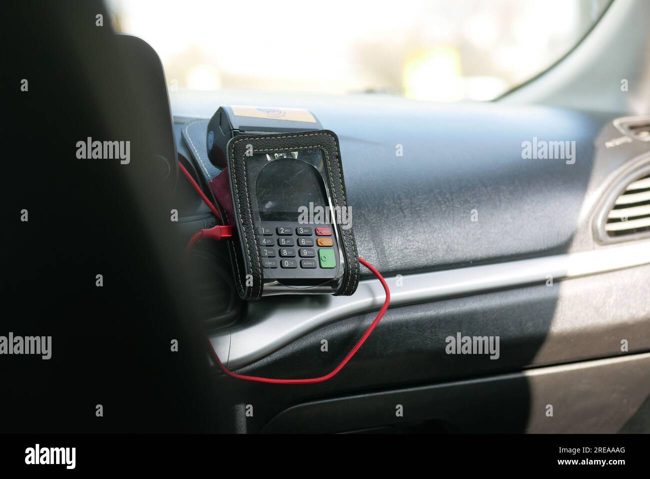 POS machine on yellow taxi Stock Photo - Alamy