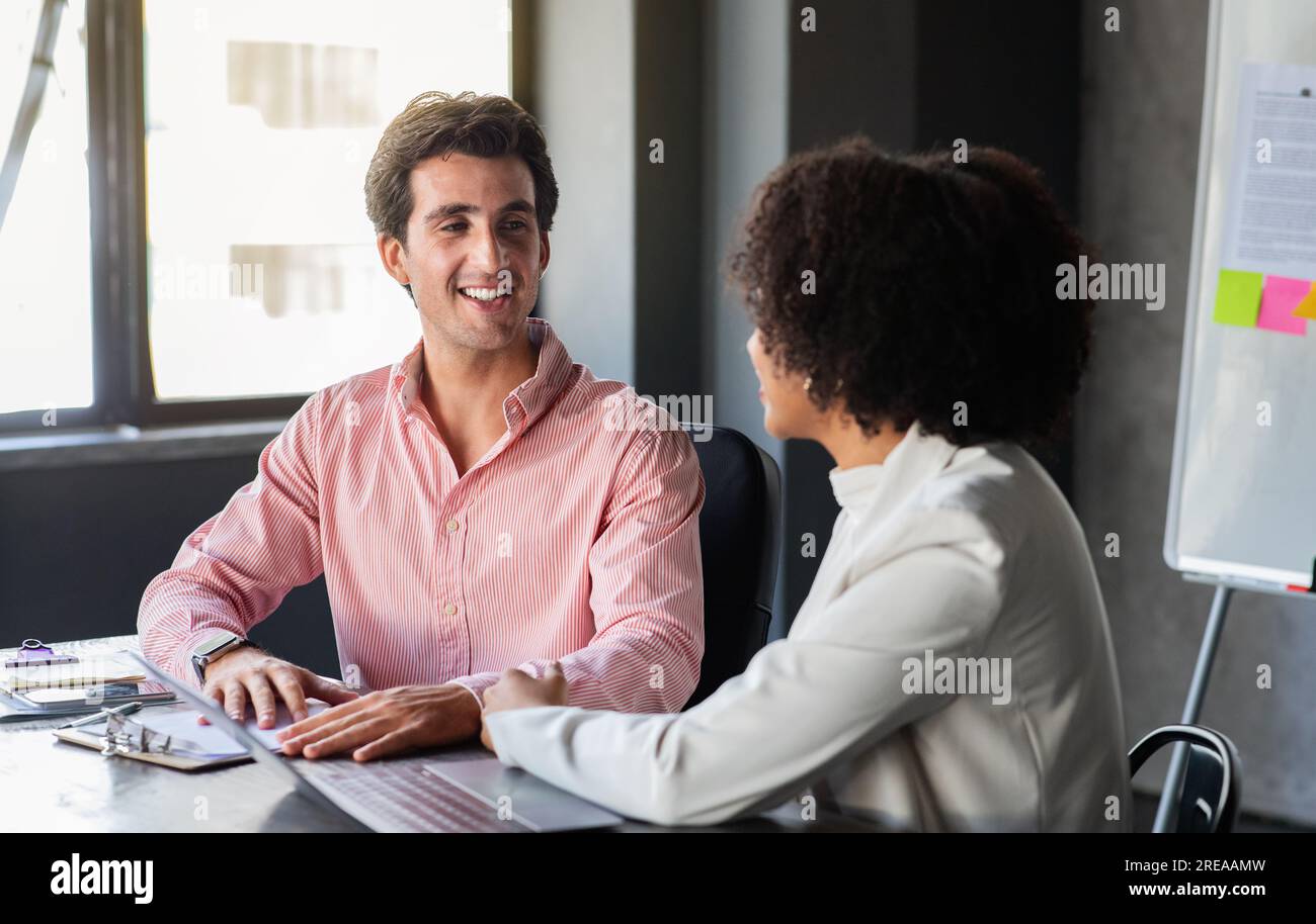 Handsome young man attending job interview with HR officer Stock Photo ...
