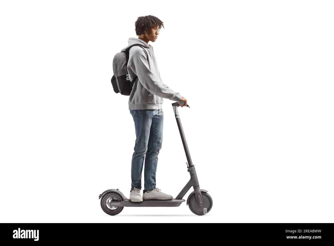 African american guy with a backpack riding on an electric scooter ...