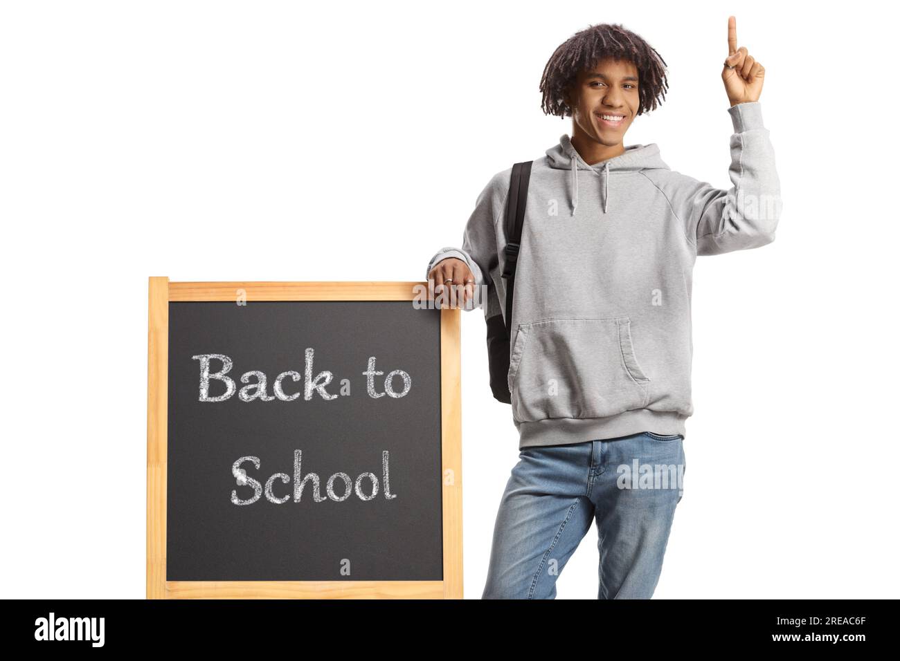 African american student leaning on a blackboard with text back to ...