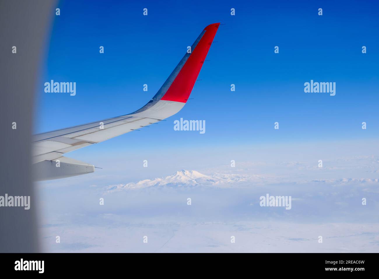Image through aircraft window onto wing. Top view over Turkey to ...
