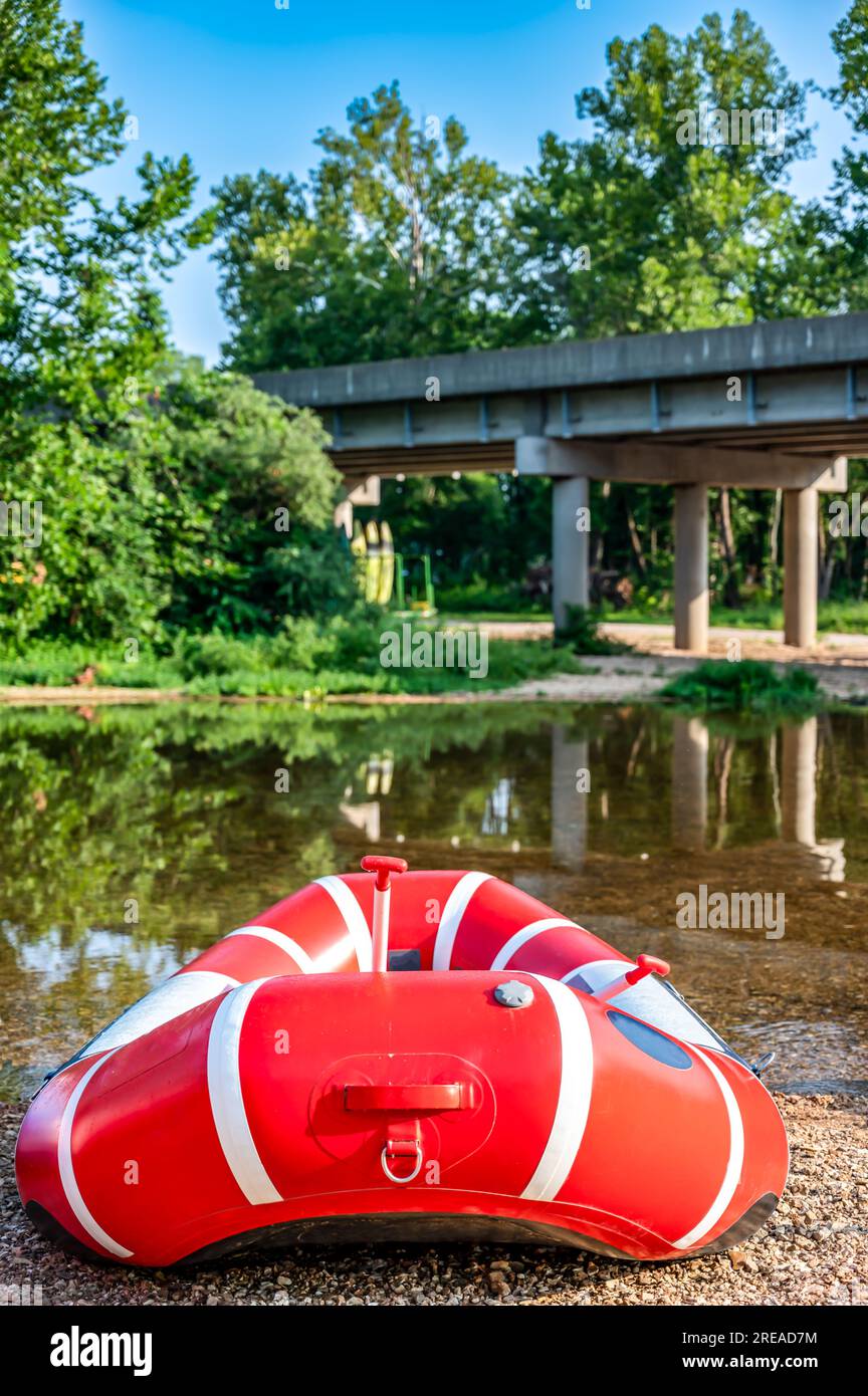 Single inflatable raft at the beginning of a float trip on a river ...