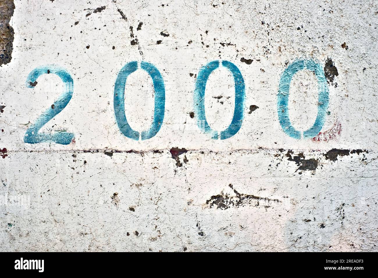 Number two thousand, 2000, blue digits on white painted wall Stock ...