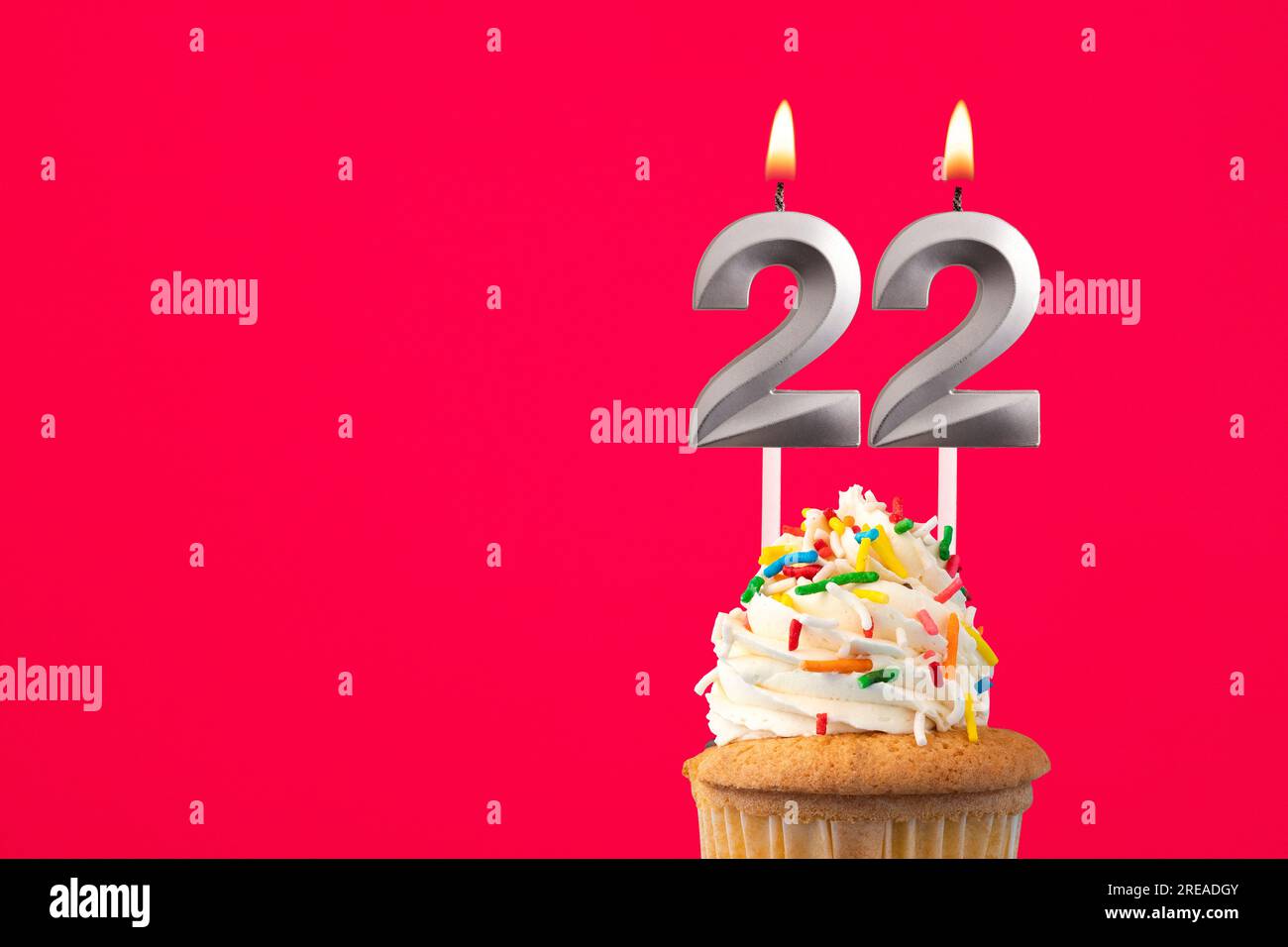 Burning candle number 22 - Birthday card with cake Stock Photo - Alamy