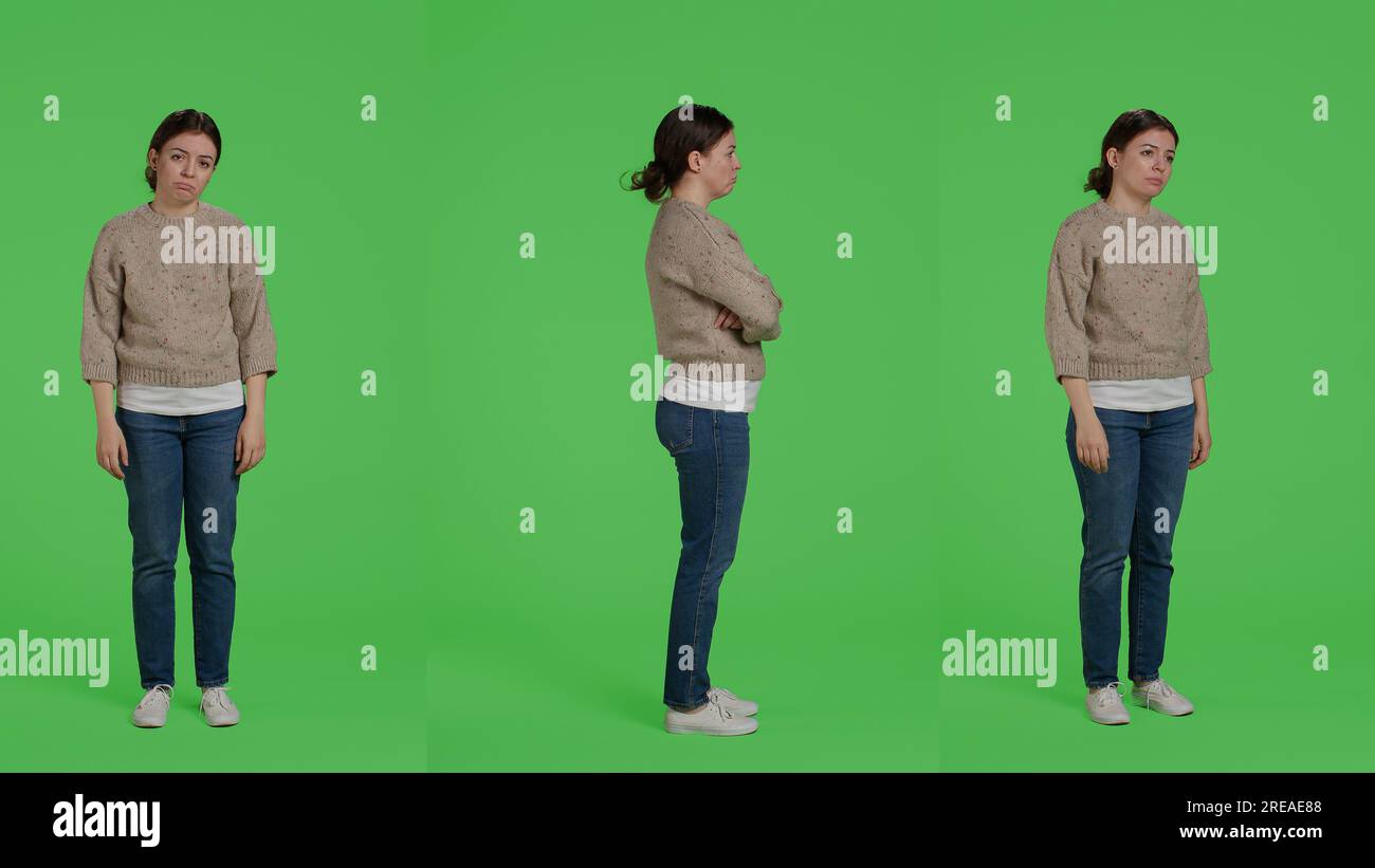 Discontent upset woman acting sad and discouraged posing over ...