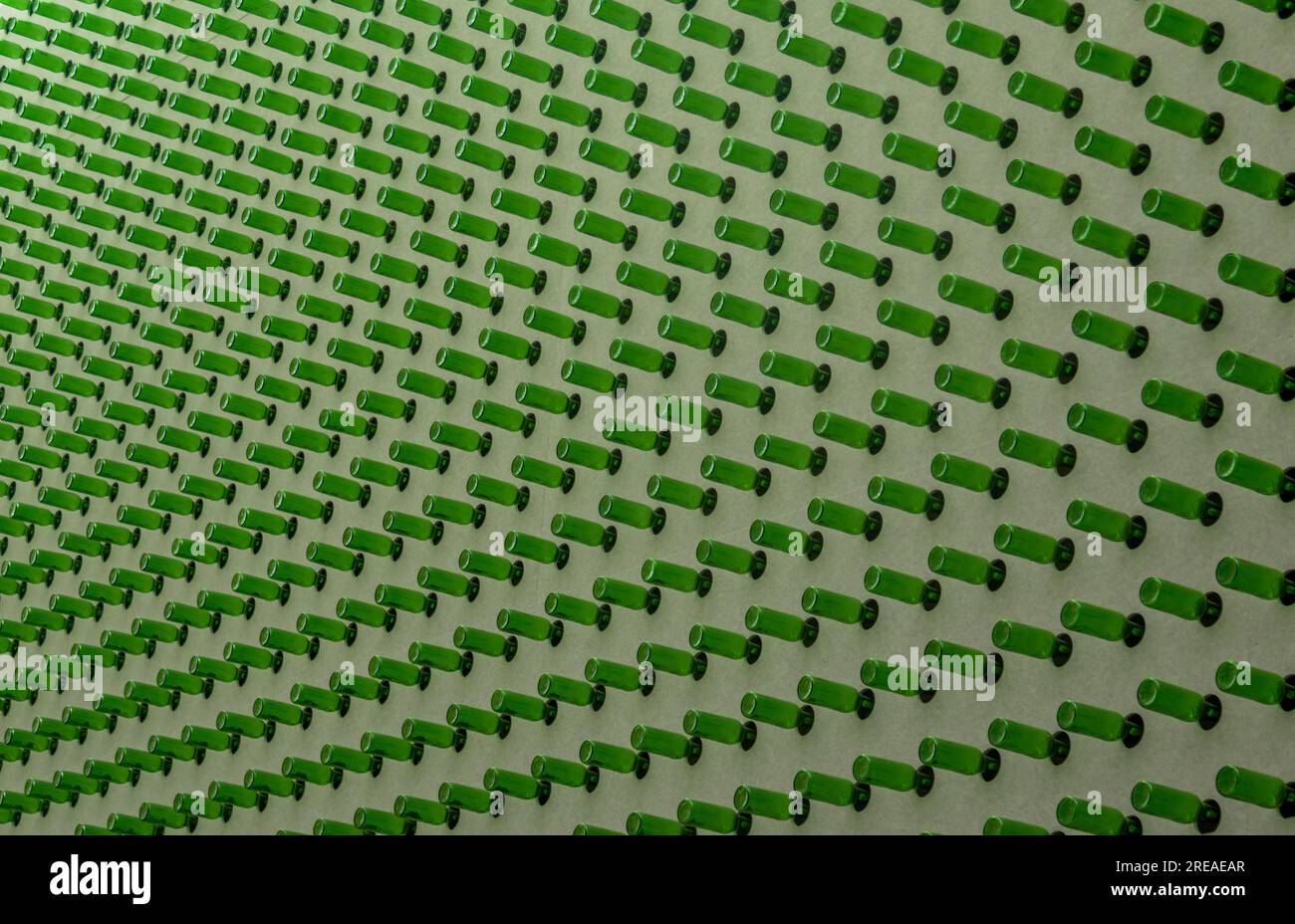 Old empty green beer bottles designed into a wall Stock Photo - Alamy