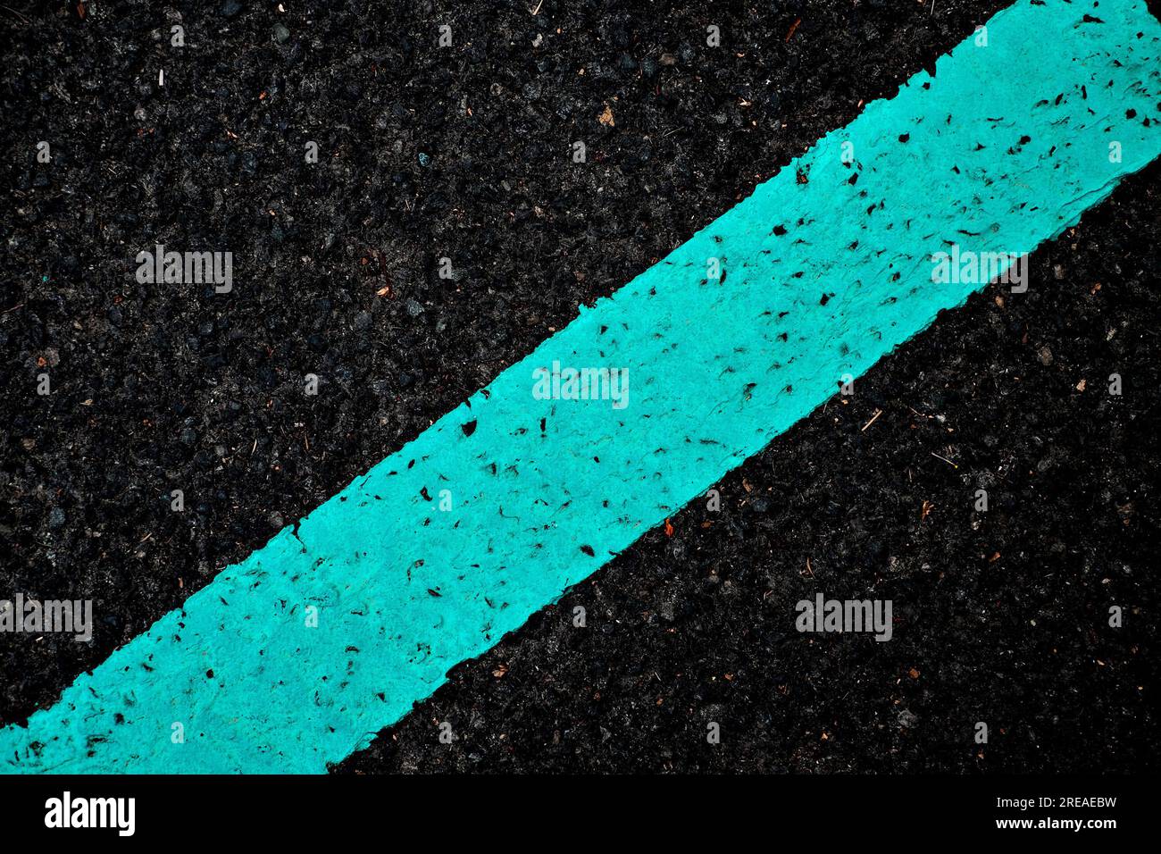Diagonal broad blue band painted on black asphalt background Stock ...