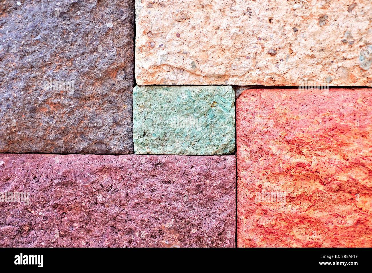 Colorful blocks organized in an abstract patchowork design of stone ...