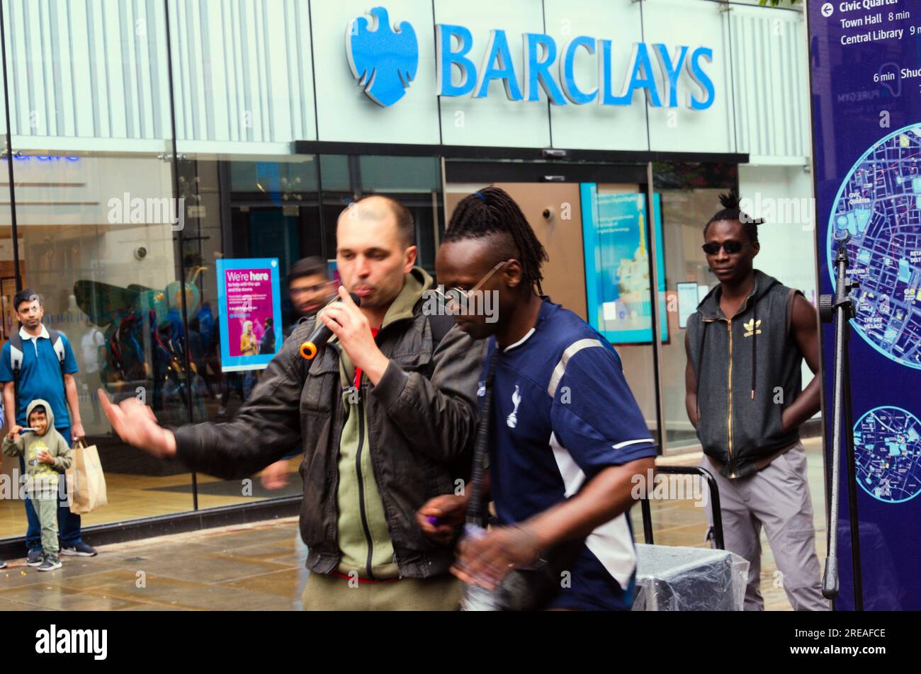 Manchester, UK, 26th July, 2023. Singers perform on Market Street ...