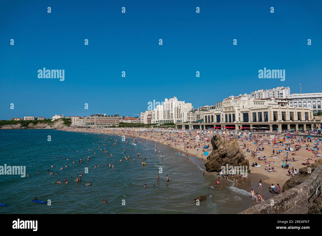 Biarritz beach full of people bathing and sunbathing on a summer ...