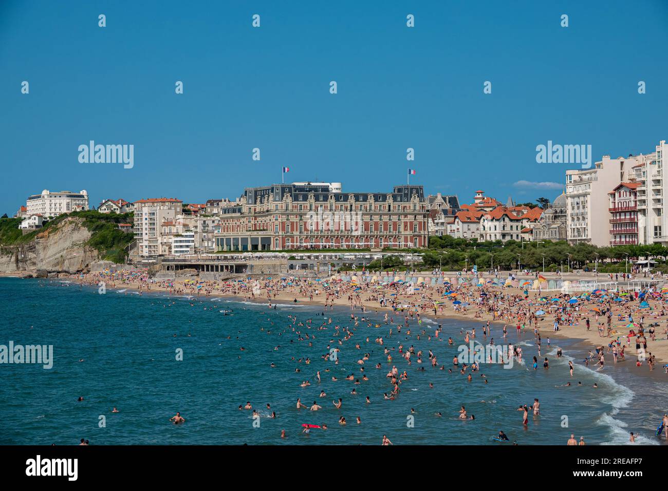 Biarritz beach full of people bathing and sunbathing on a summer ...