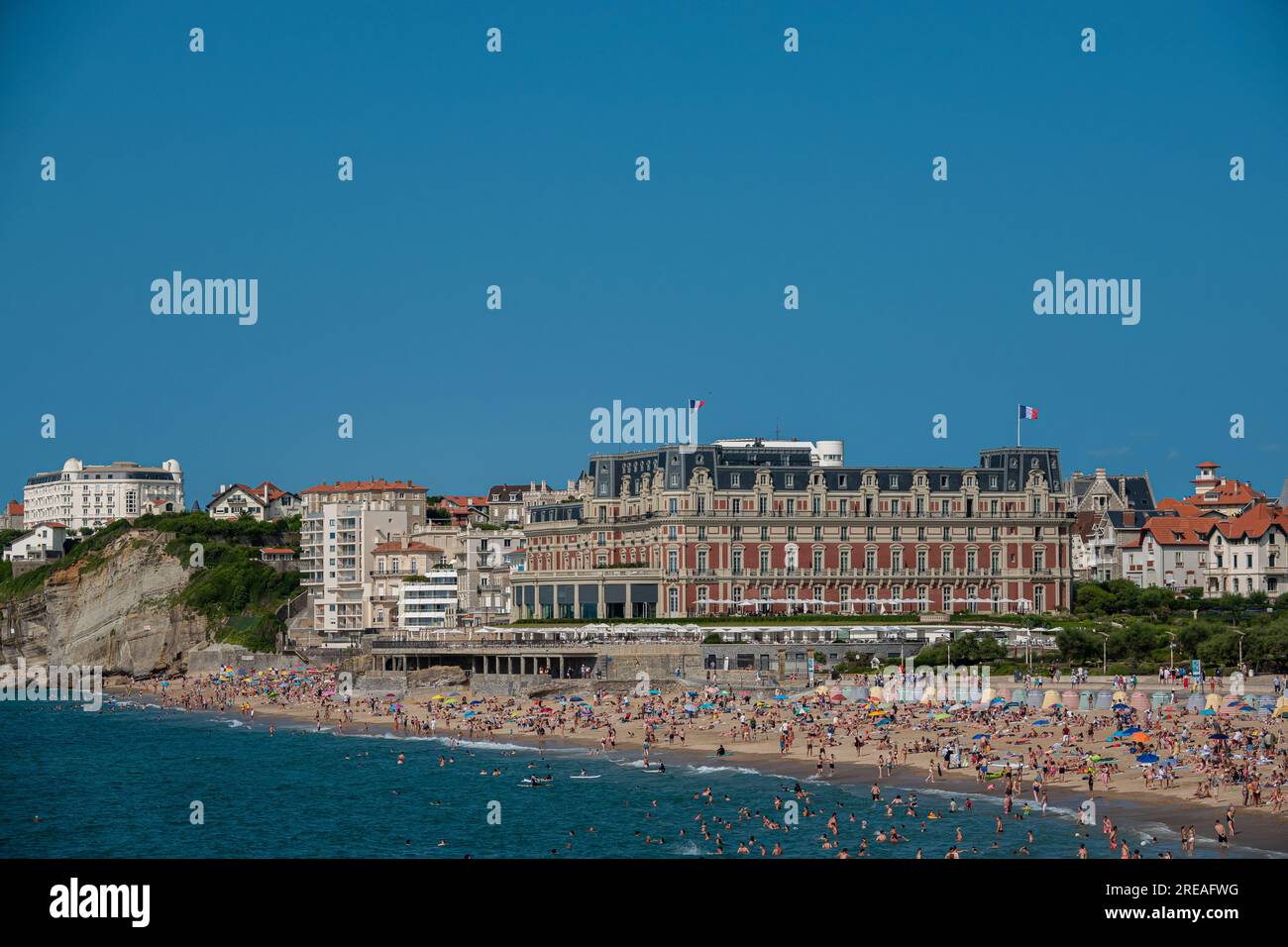 Biarritz beach full of people bathing and sunbathing on a summer ...